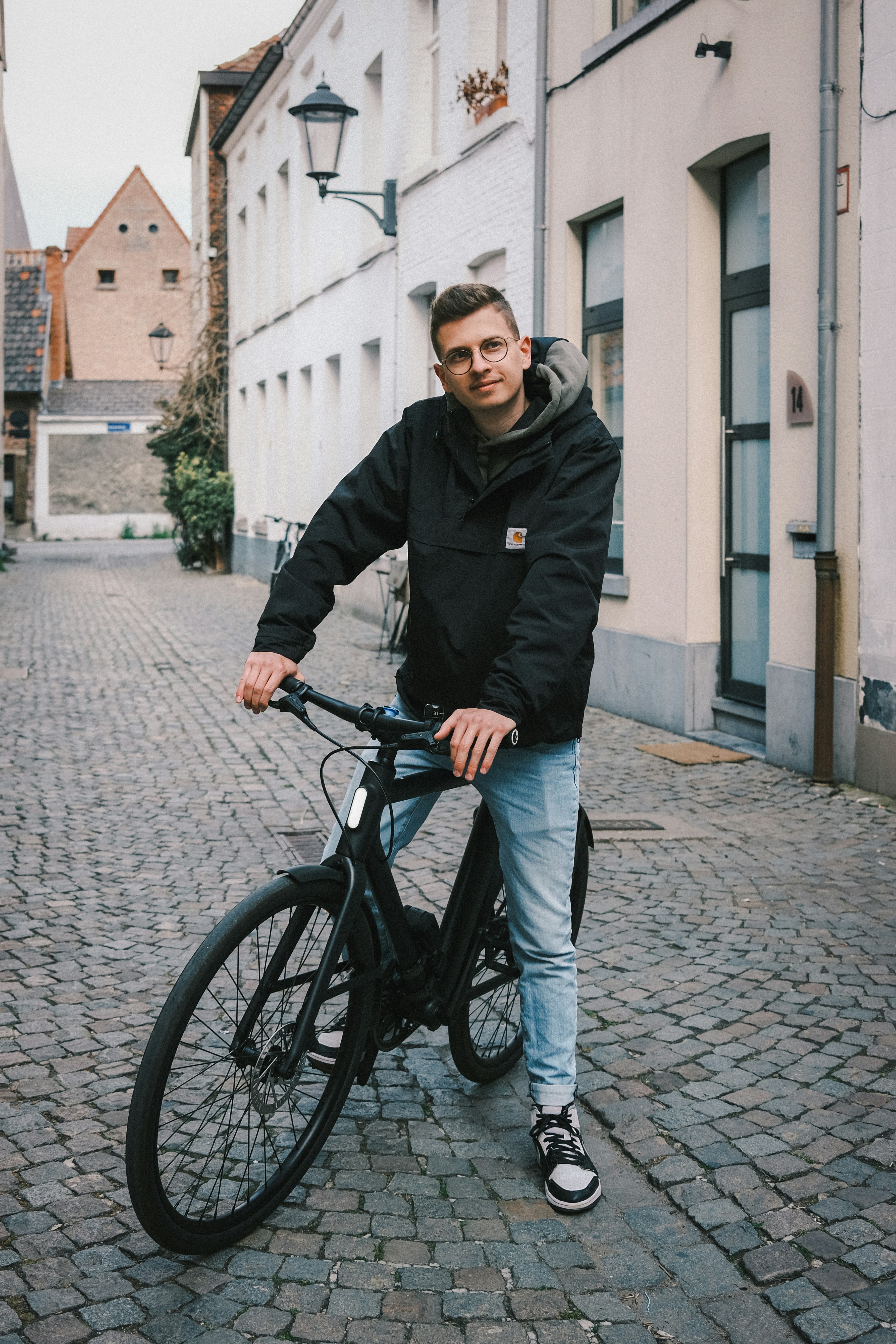 Guy on an electric bike from Cowboy in the city.