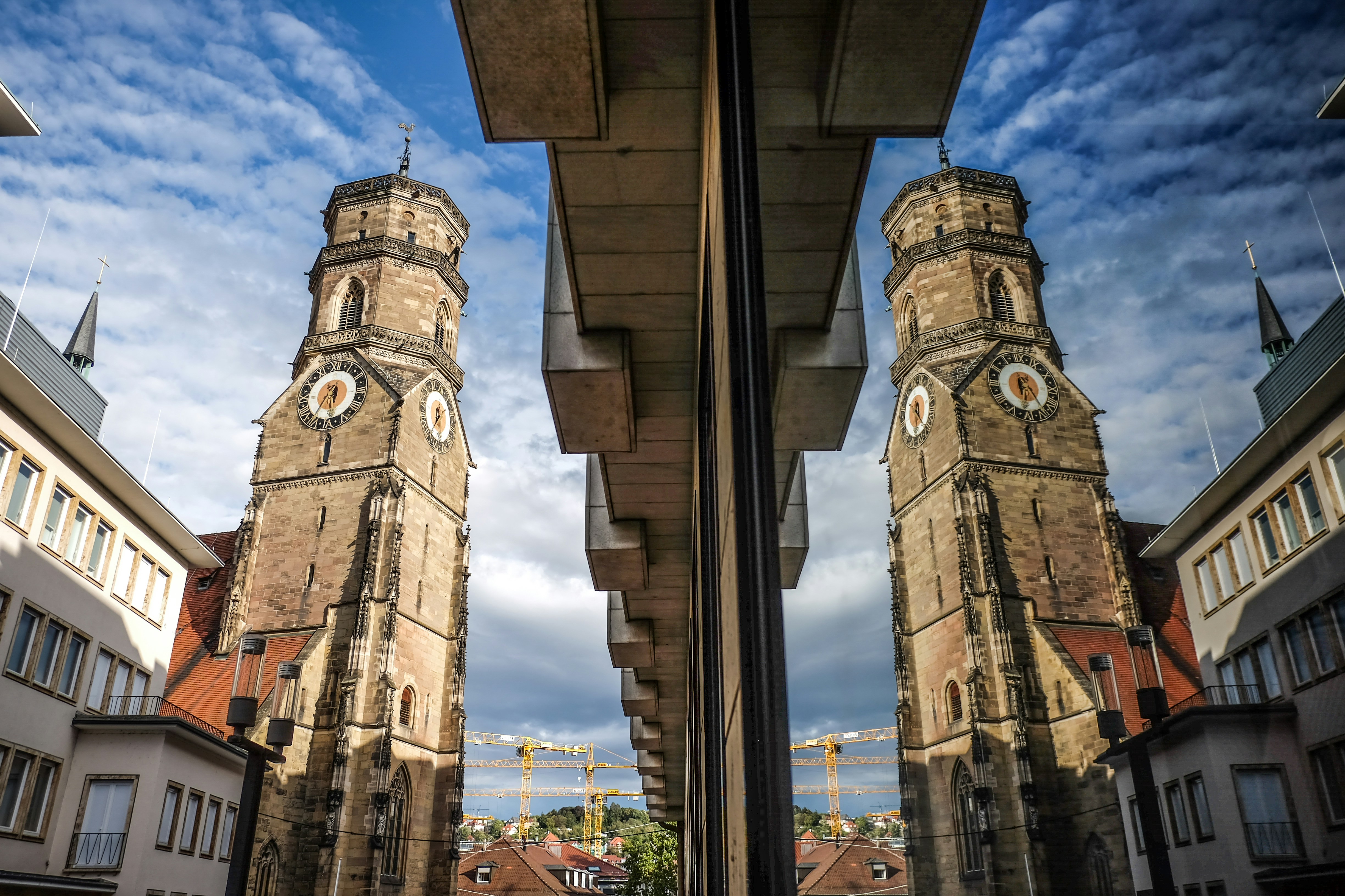 Glass Divider, Twin Clock Towers: a City’s Mirror