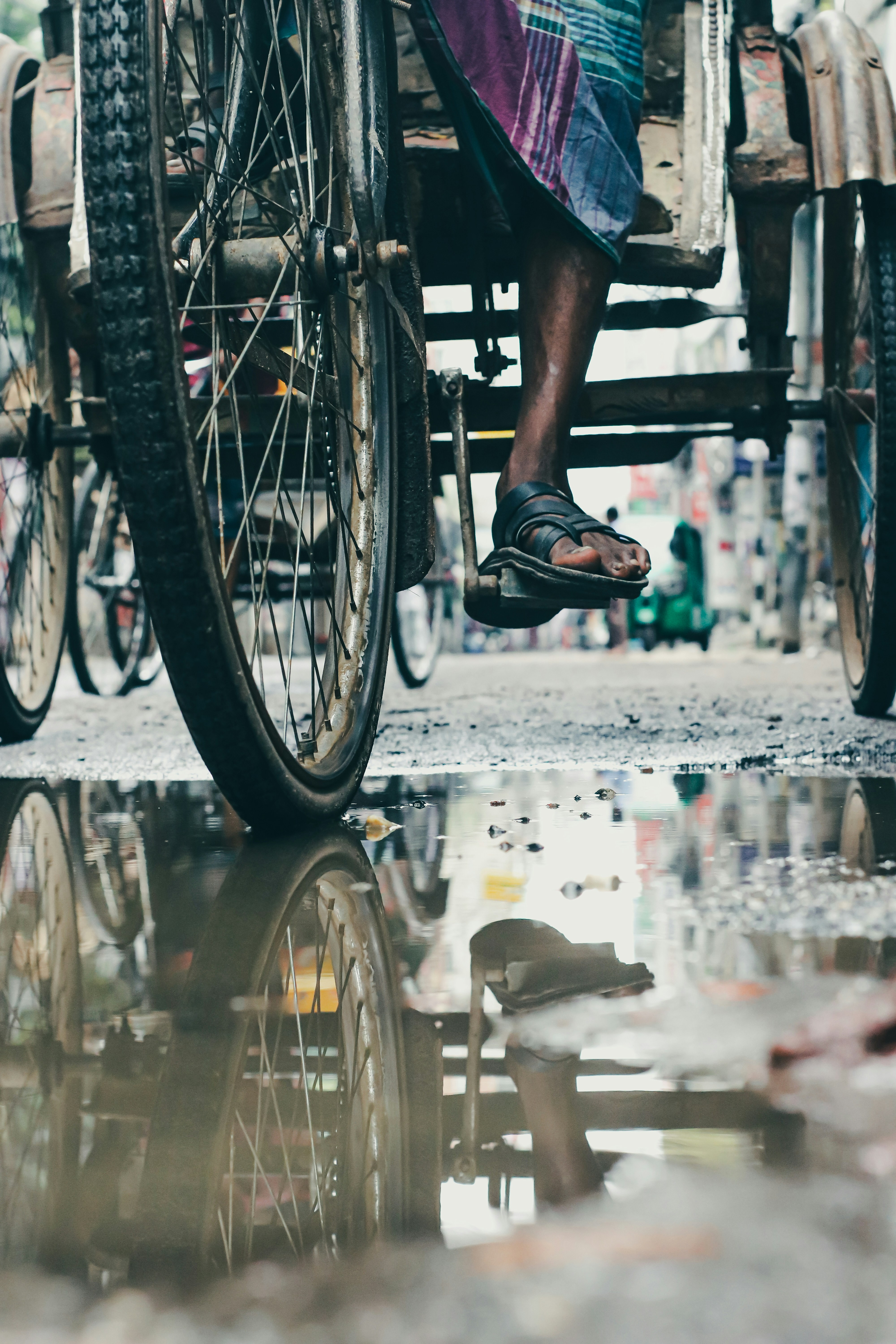 Pedaled Passage: a Footstep in a Rainy Street