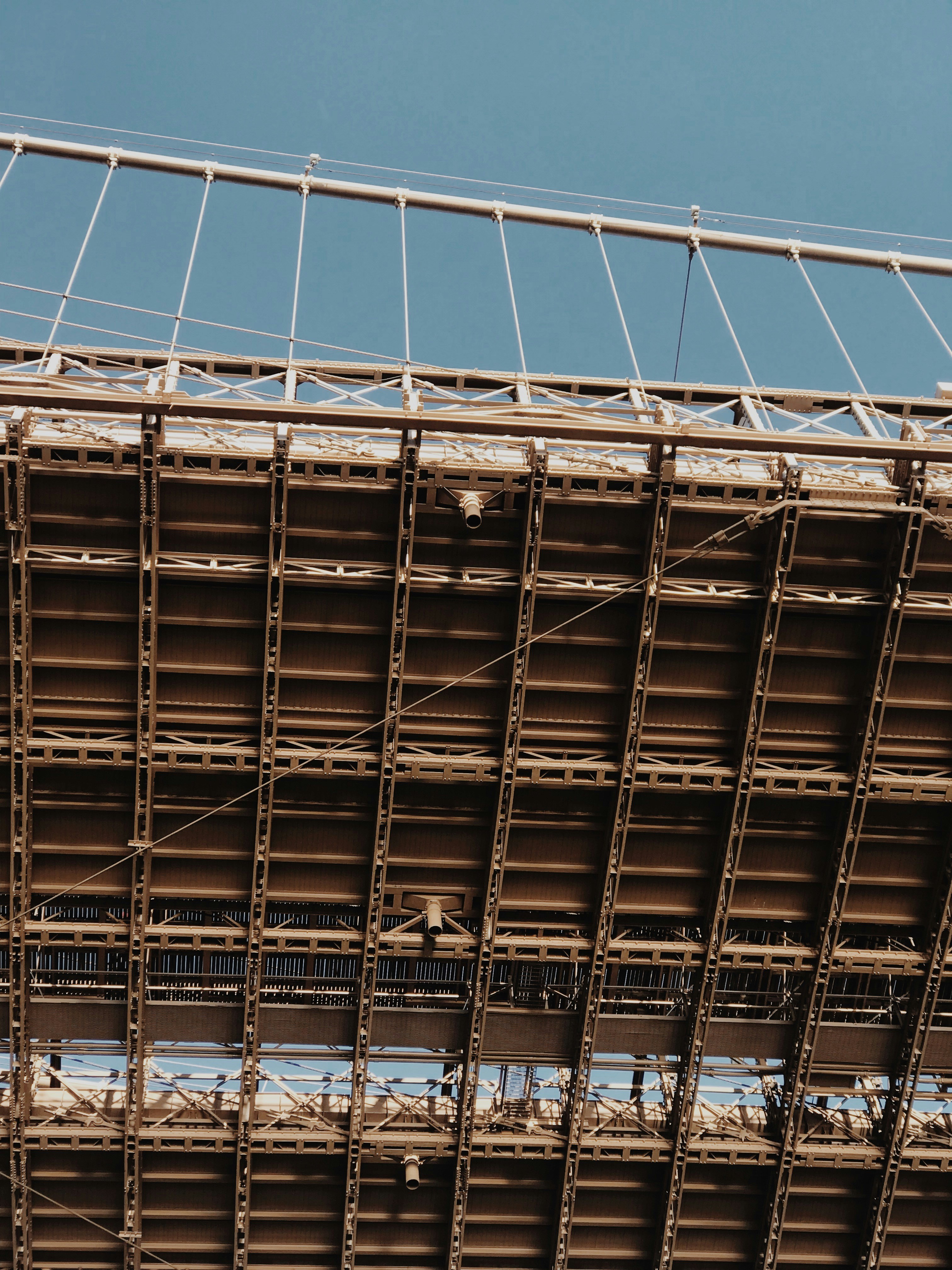 Underbridge Lattice: Steel Grid, Cable Tension, and Sky