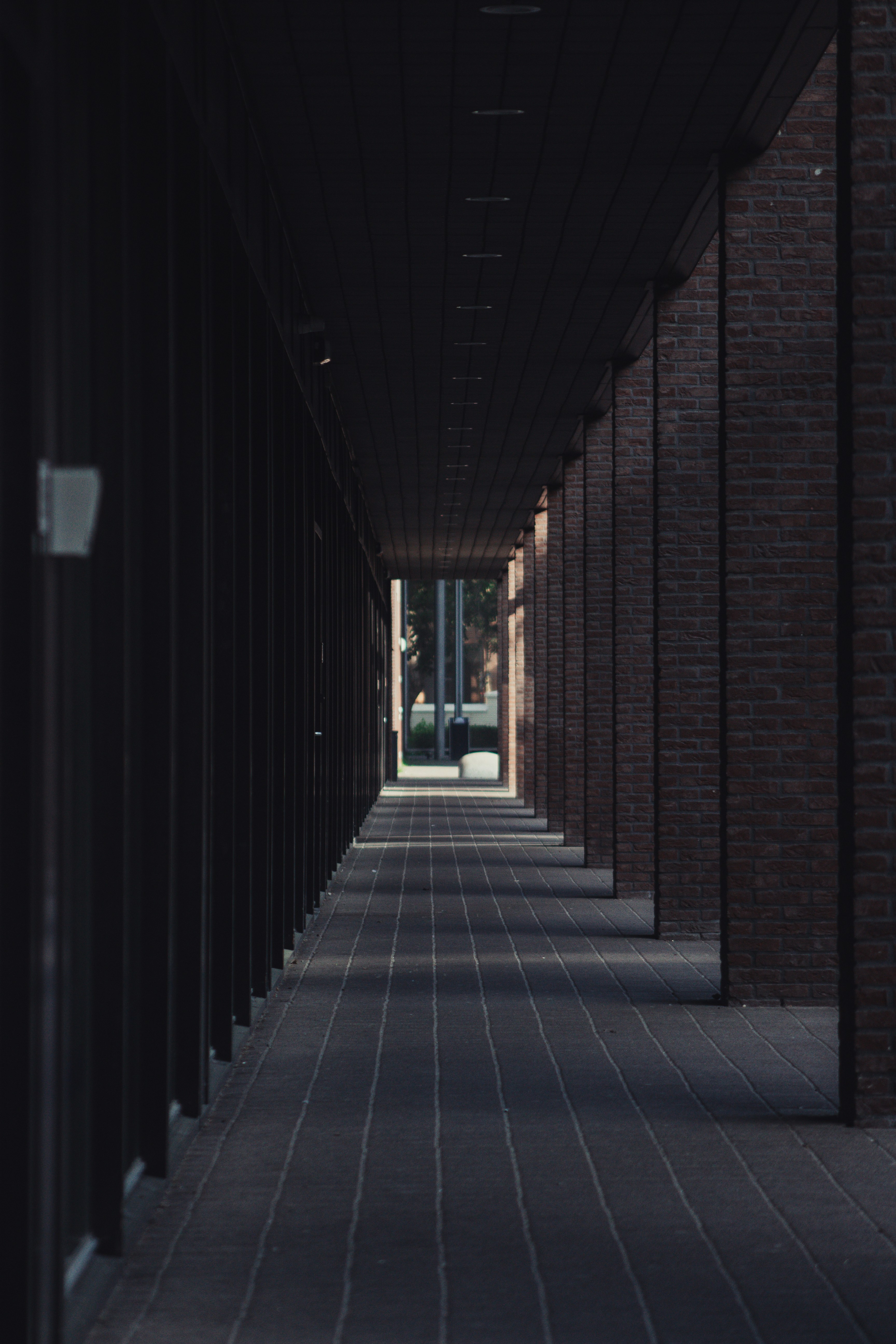 Person walking on hallway during daytime photo – Free Eindhoven Image ...