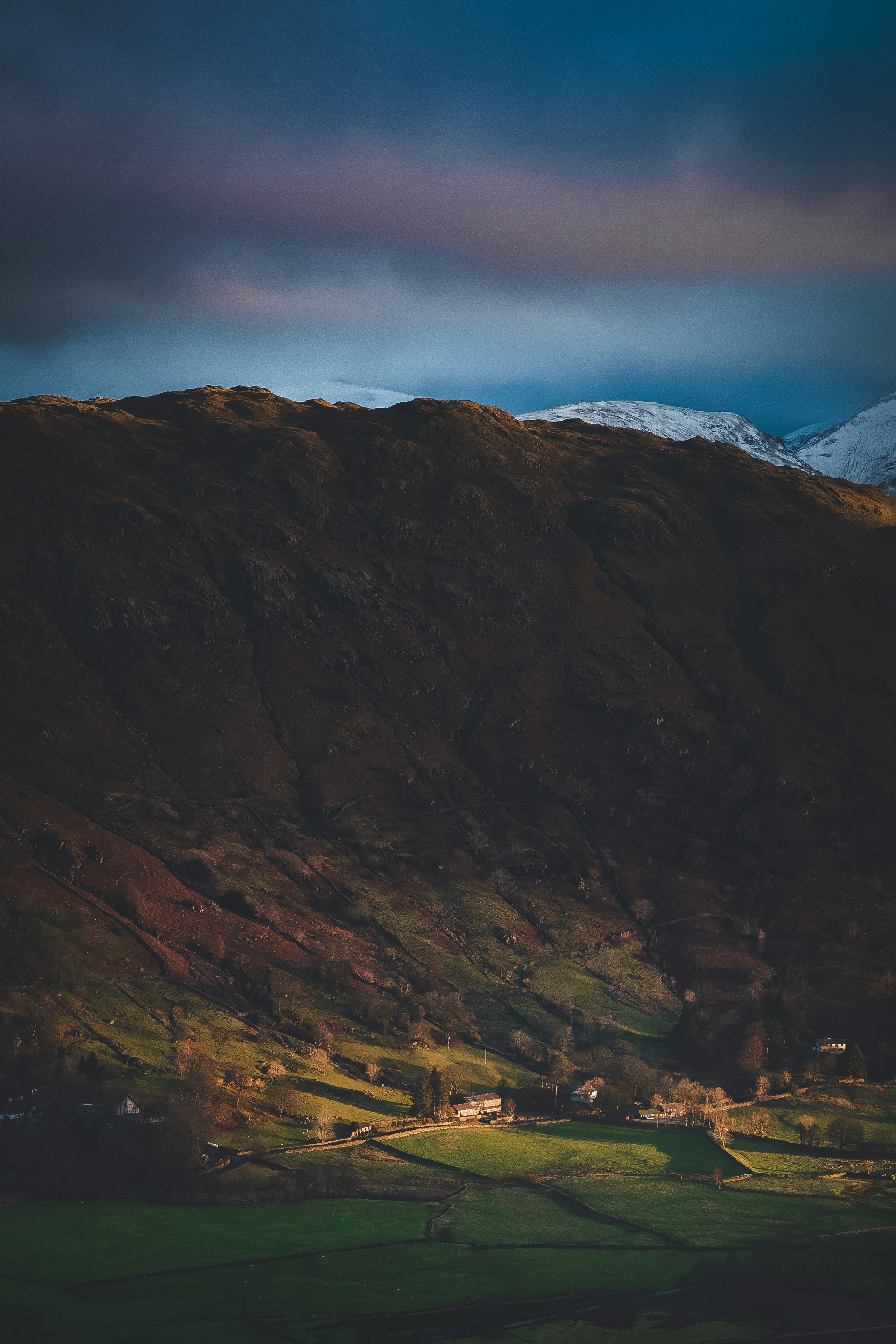 Sunlit Valley Beneath a Mountain Crest