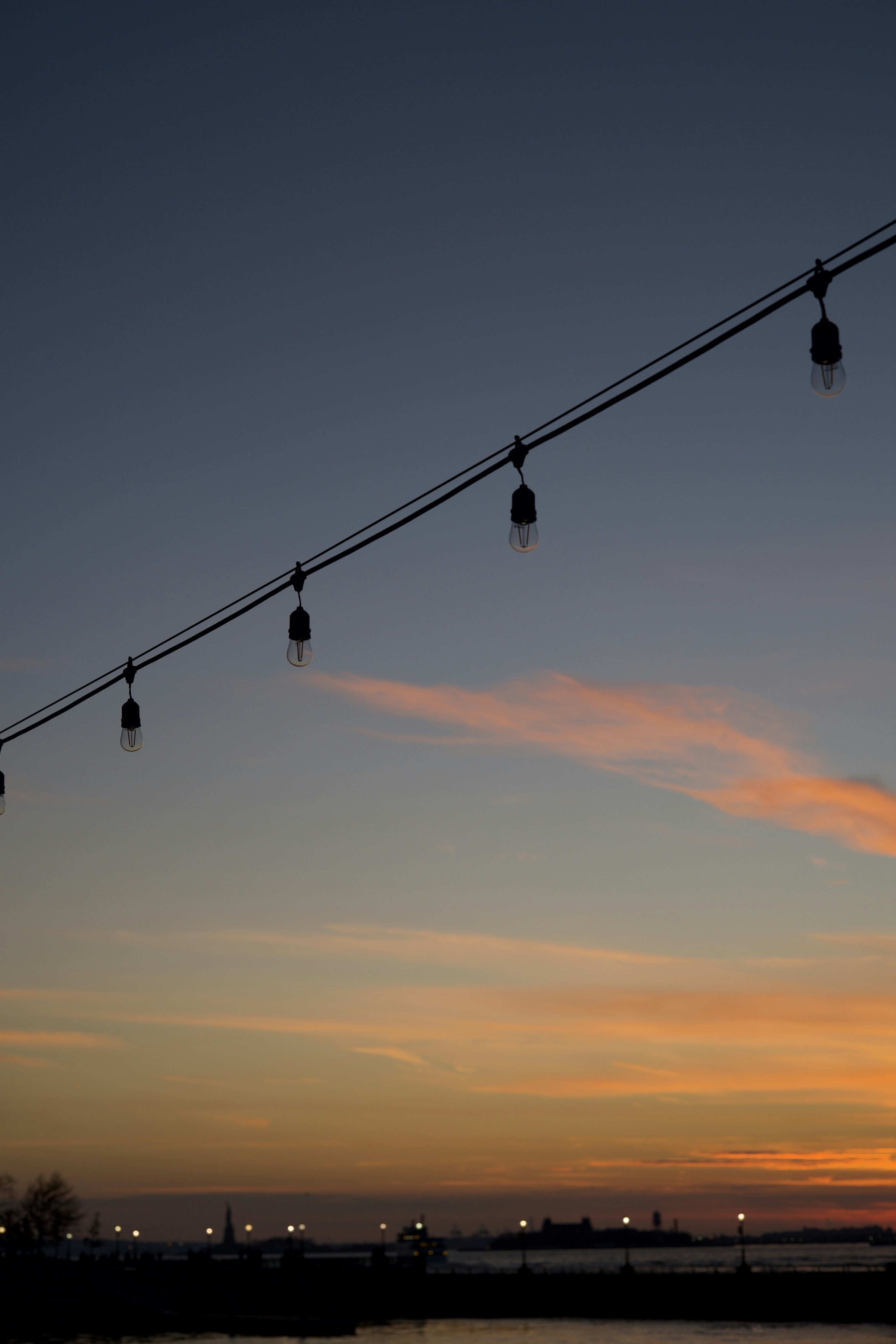 String of Evening Lights Across a Quiet Horizon