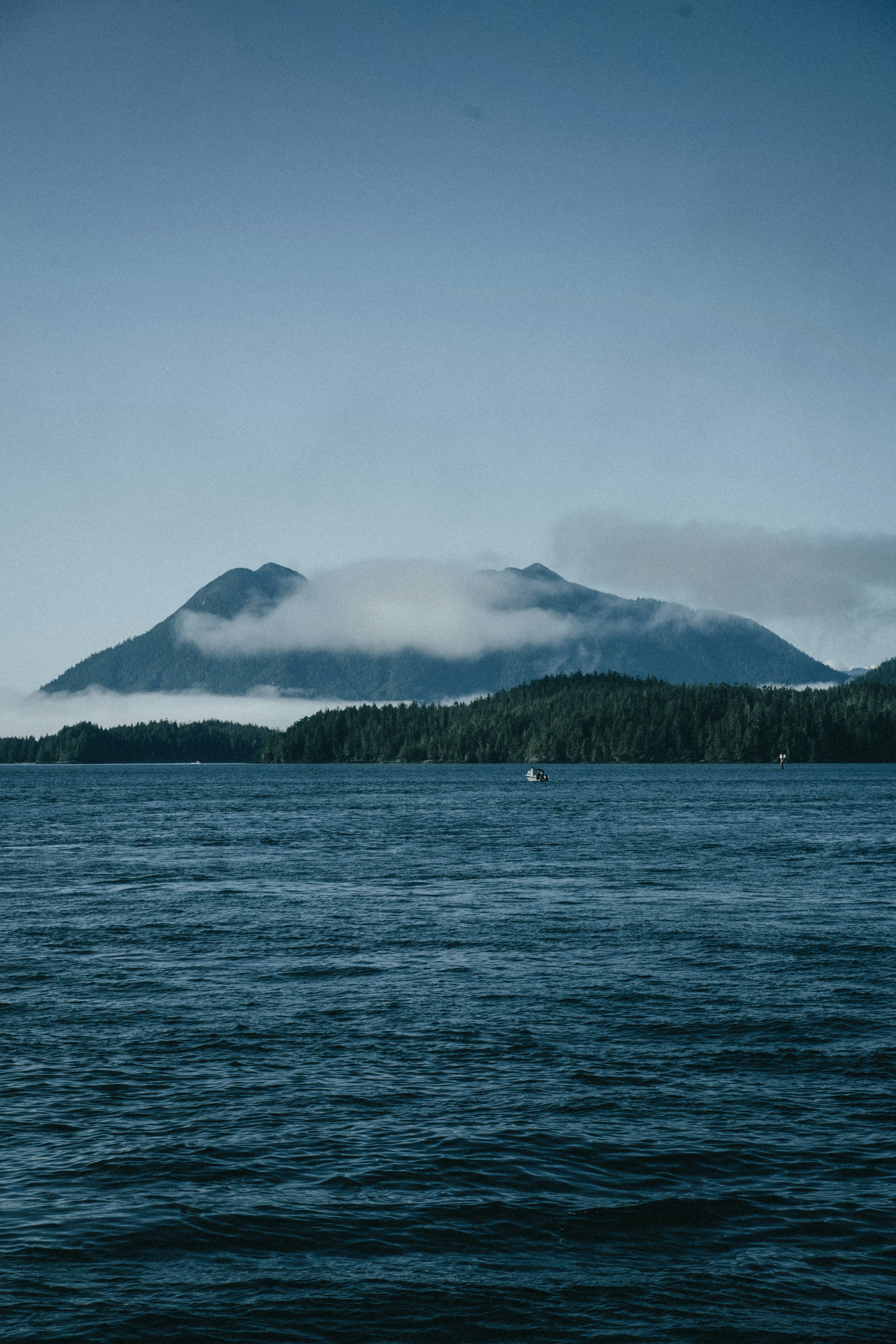 Cloud-veiled Peaks over a Quiet Pacific