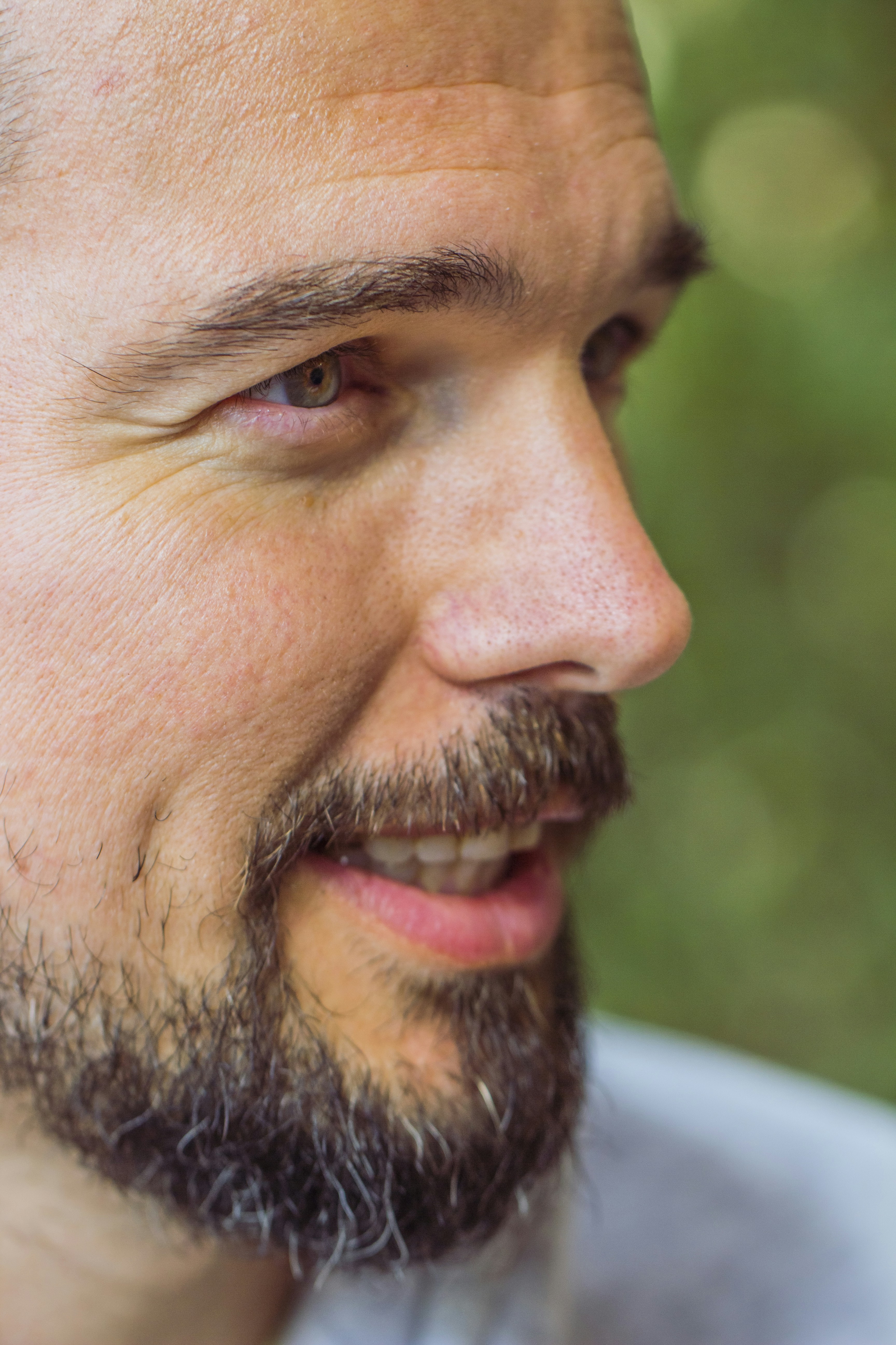 Emerald Gaze: A Close Portrait in Soft Forest Light