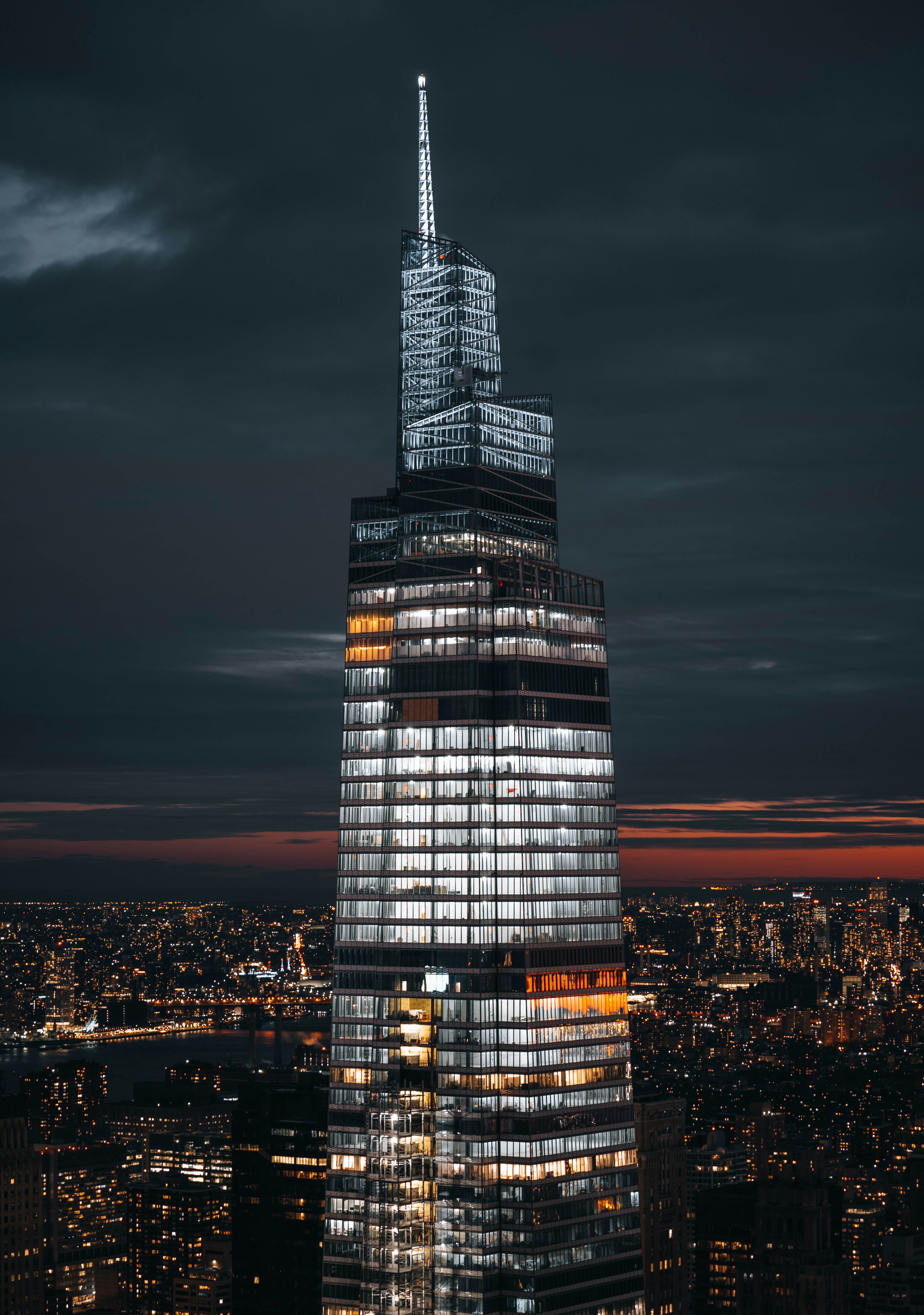Midnight Crown: The Glass-Tower Ascending Above a City at Dusk