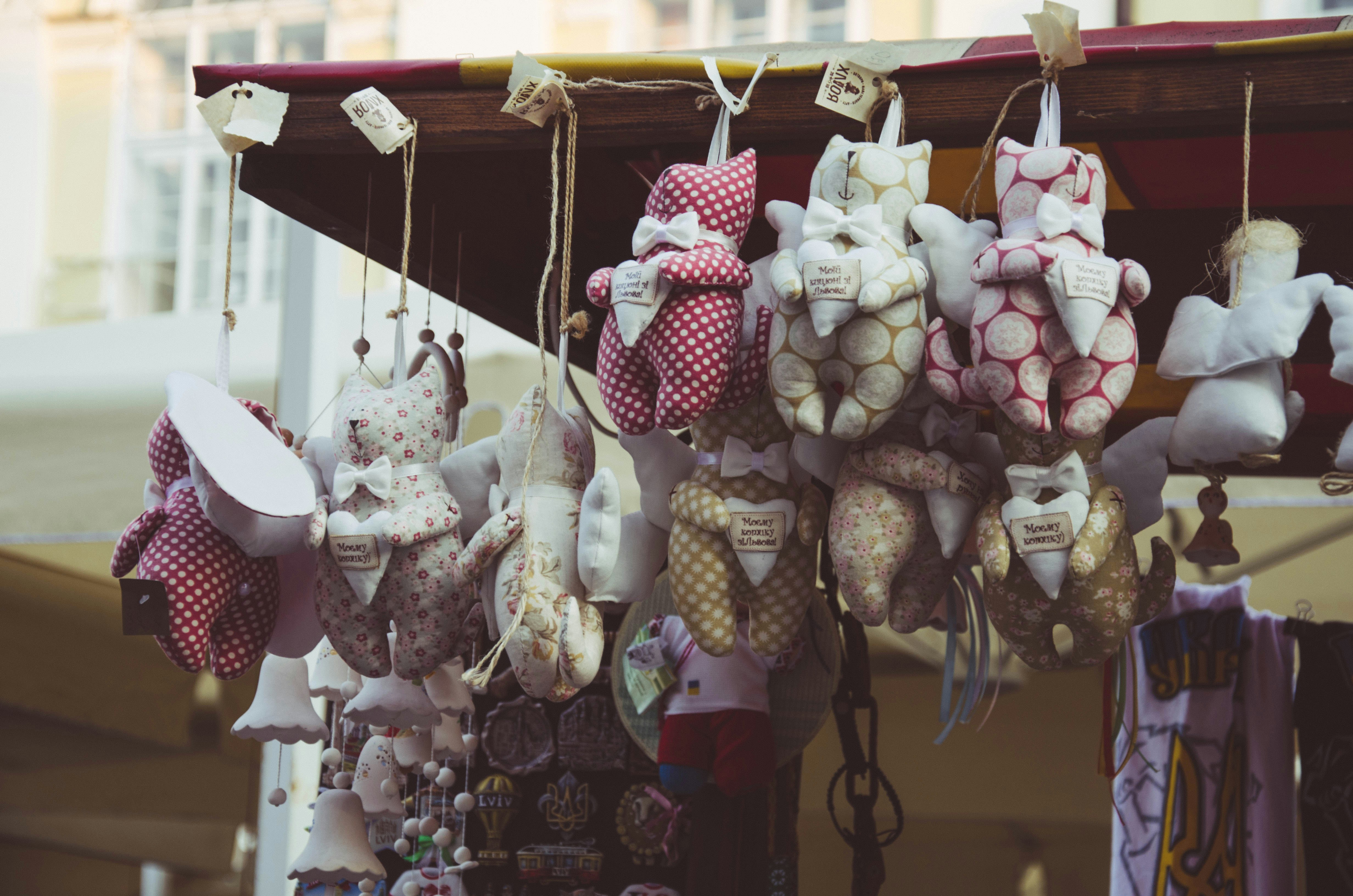 Whimsical Plush Companions at a Sunlit Market Stall