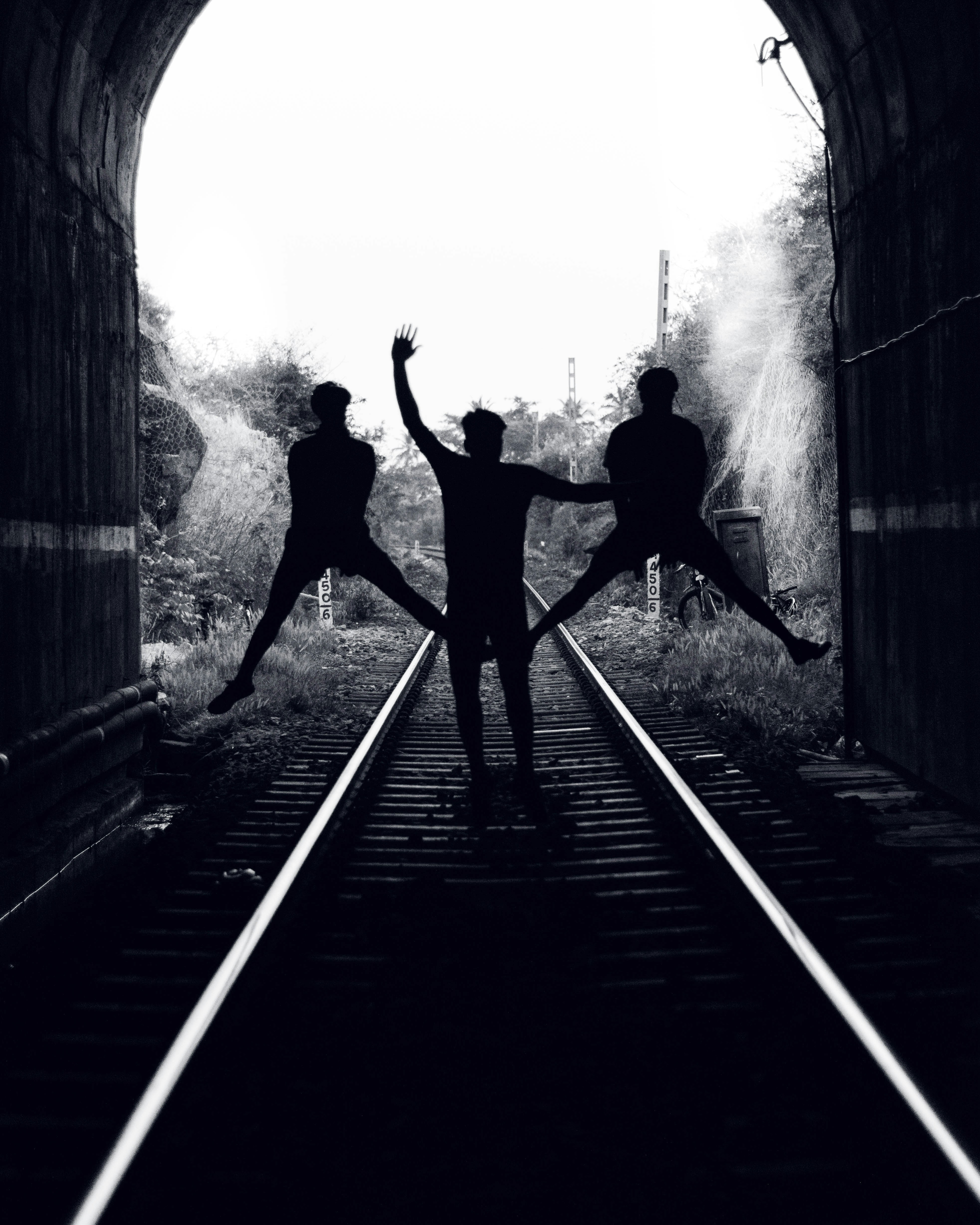 2 men standing on train rail during daytime photo – Free Building Image ...