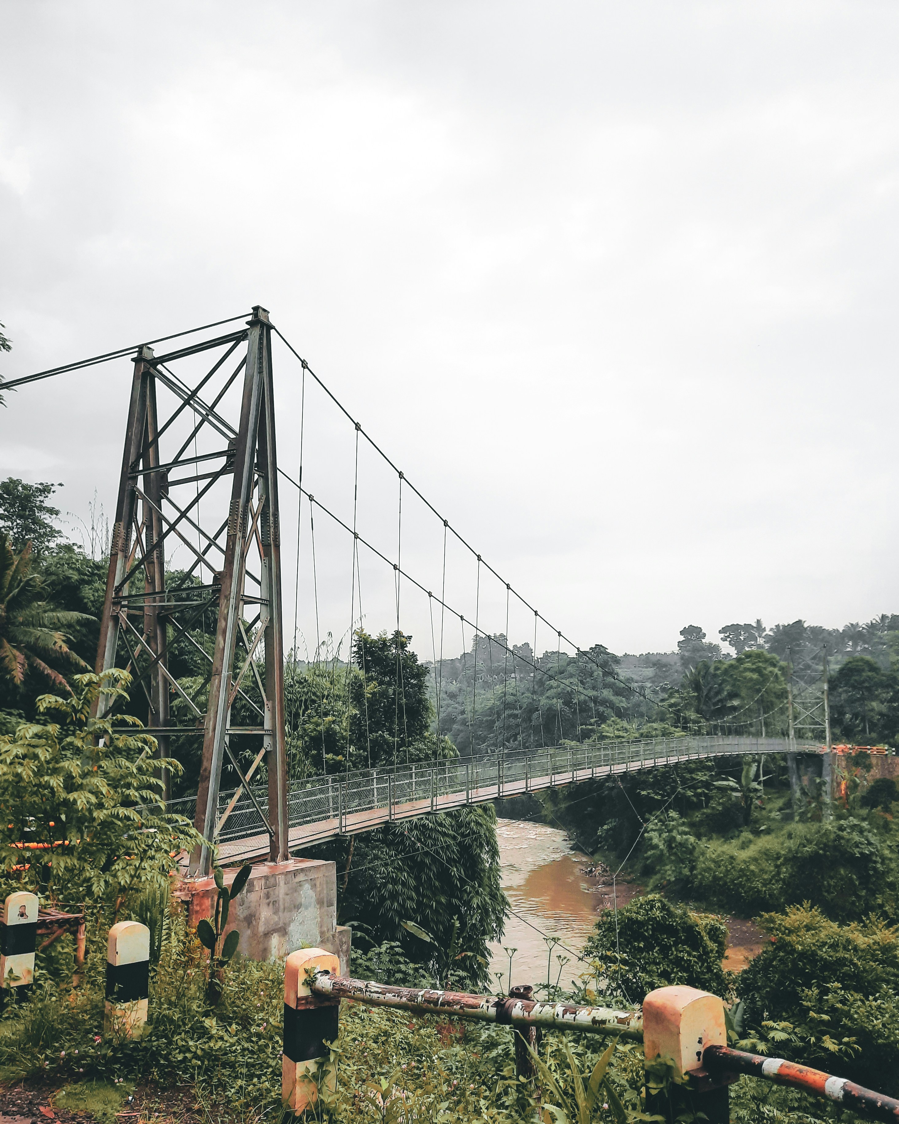 gray metal bridge over river