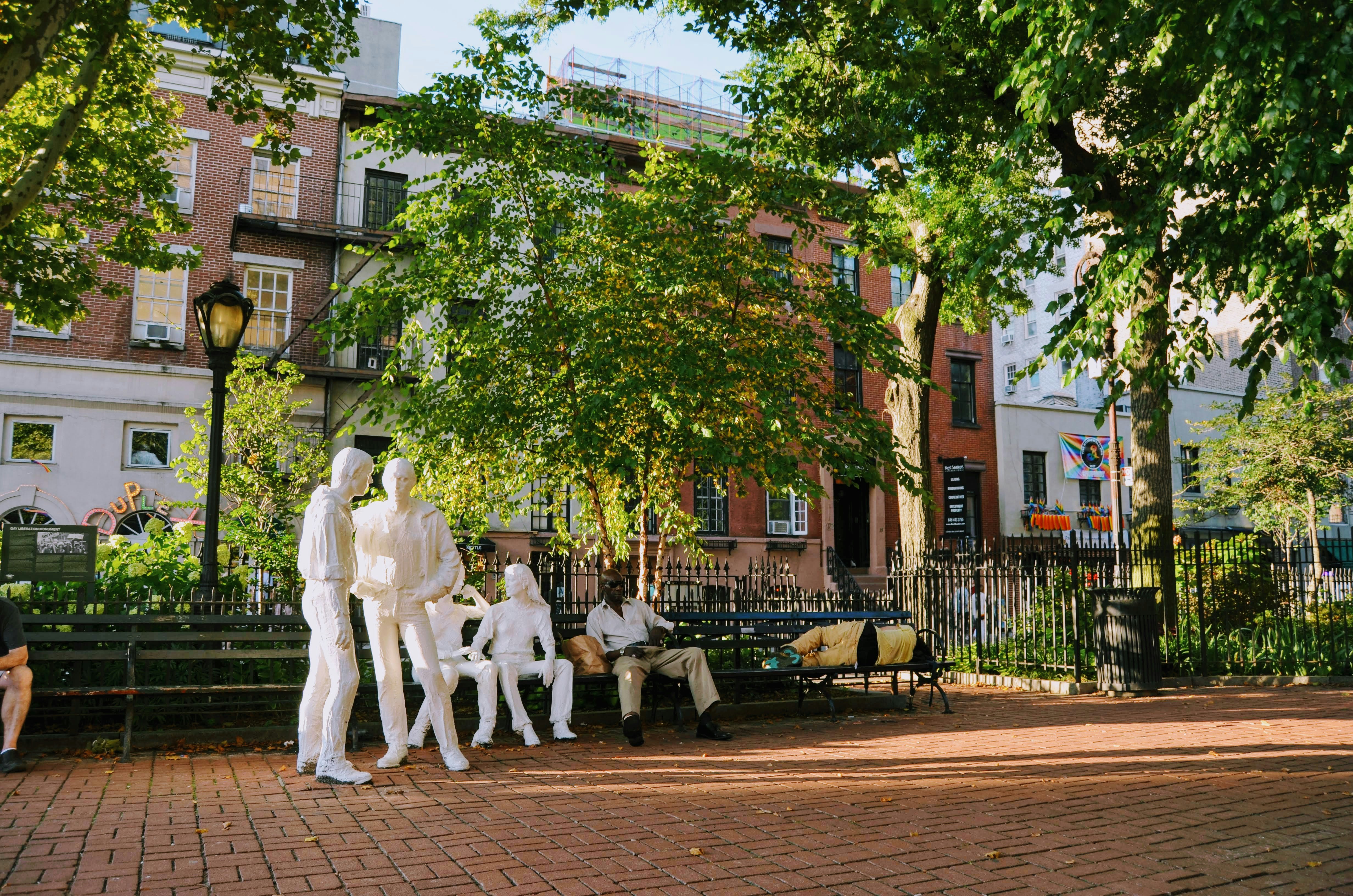 Quiet Cards in the Park: Figures in a Sunlit Brickyard