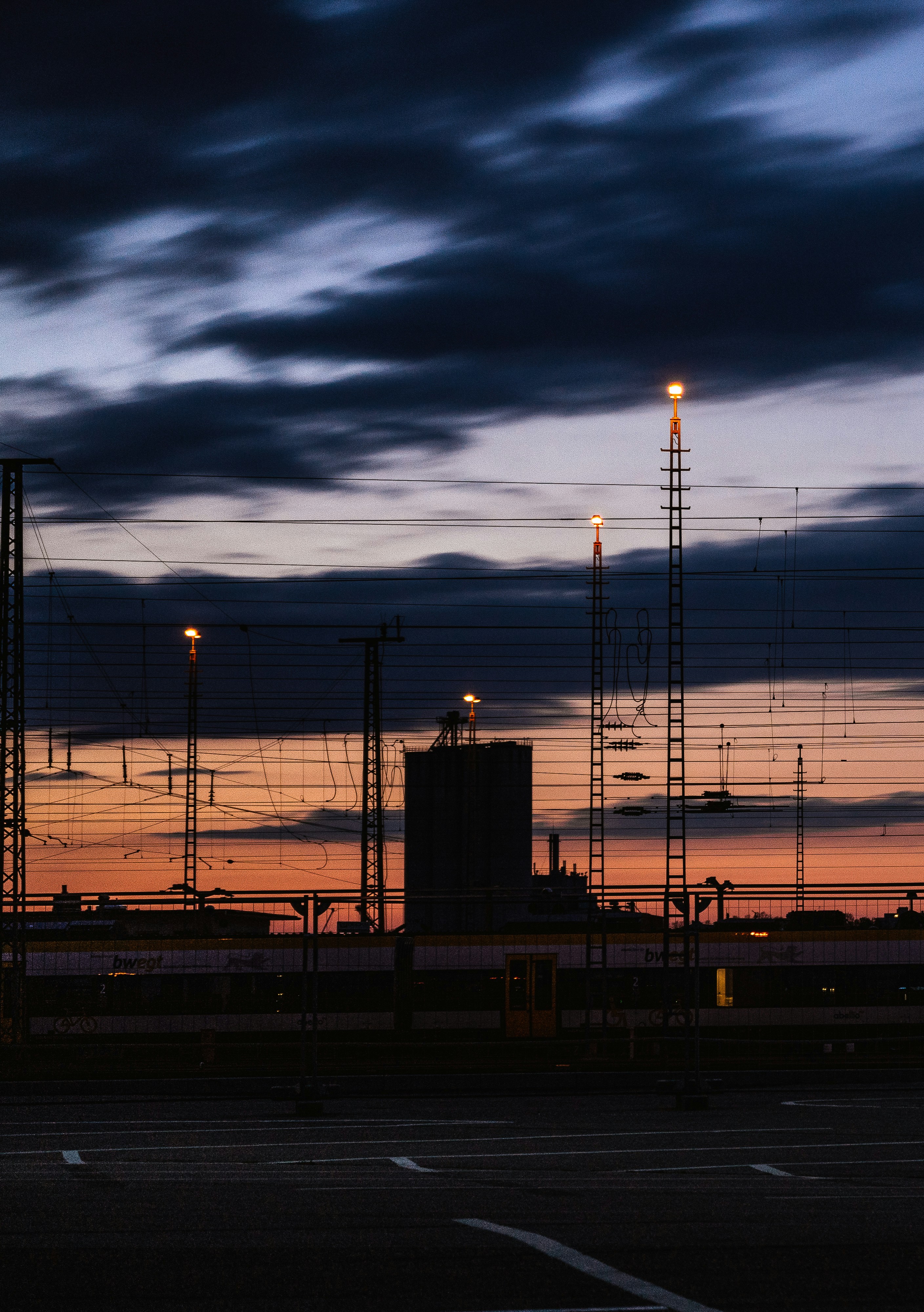 Rising Lights Over Quiet Rails at Twilight