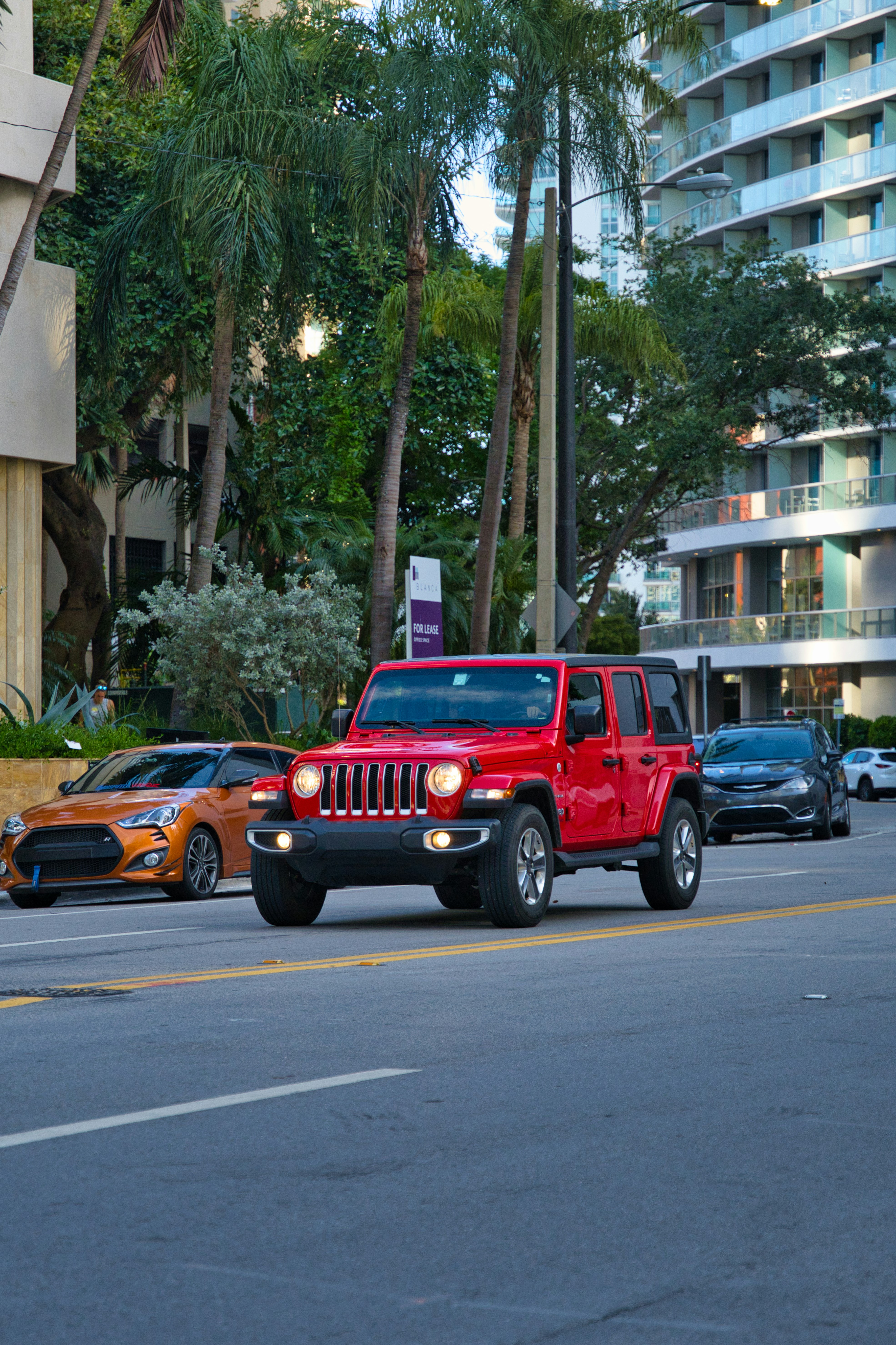 Crimson Jeep Leading the Street Parade