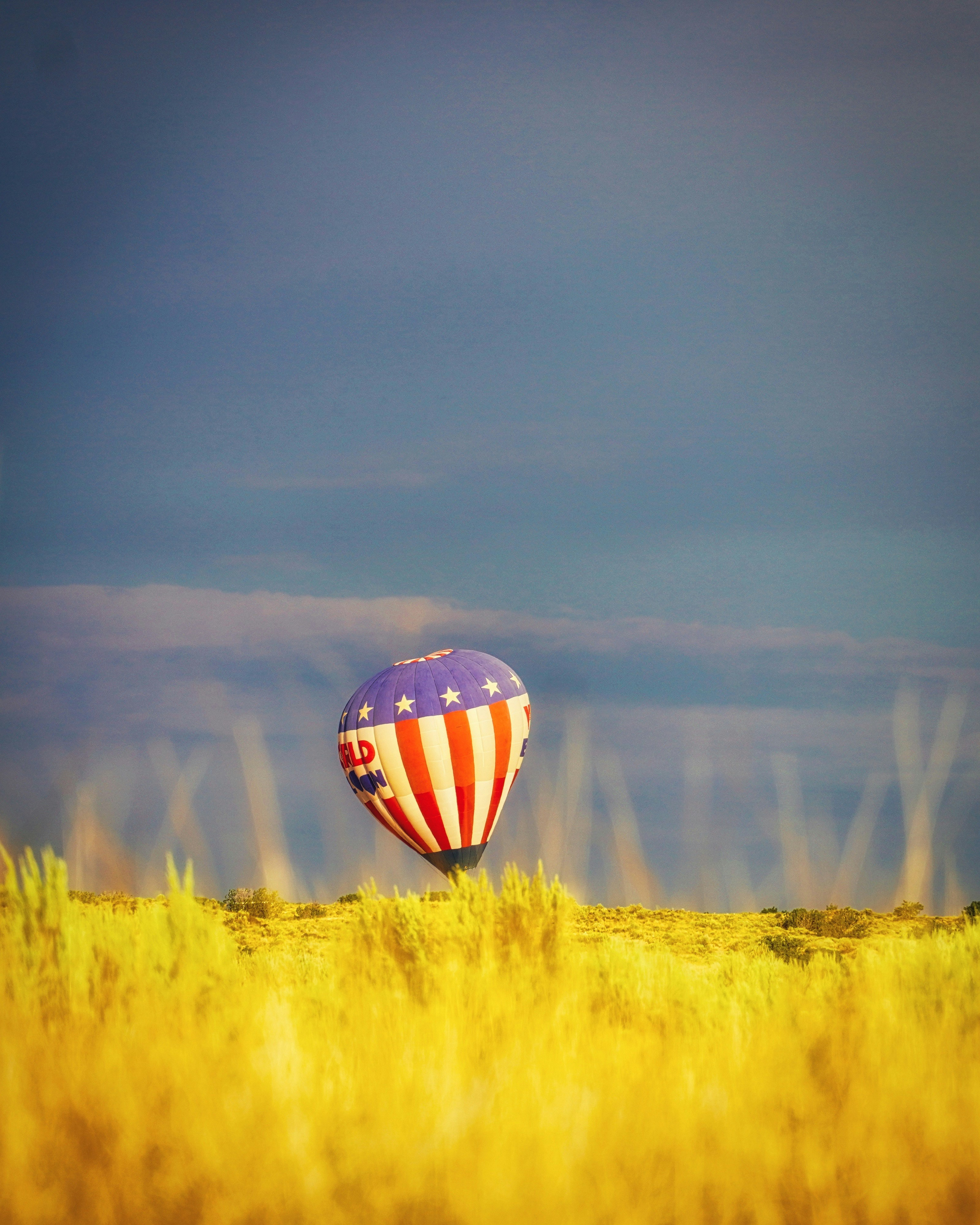 Patriotic Balloon Rises Over Golden Dunes