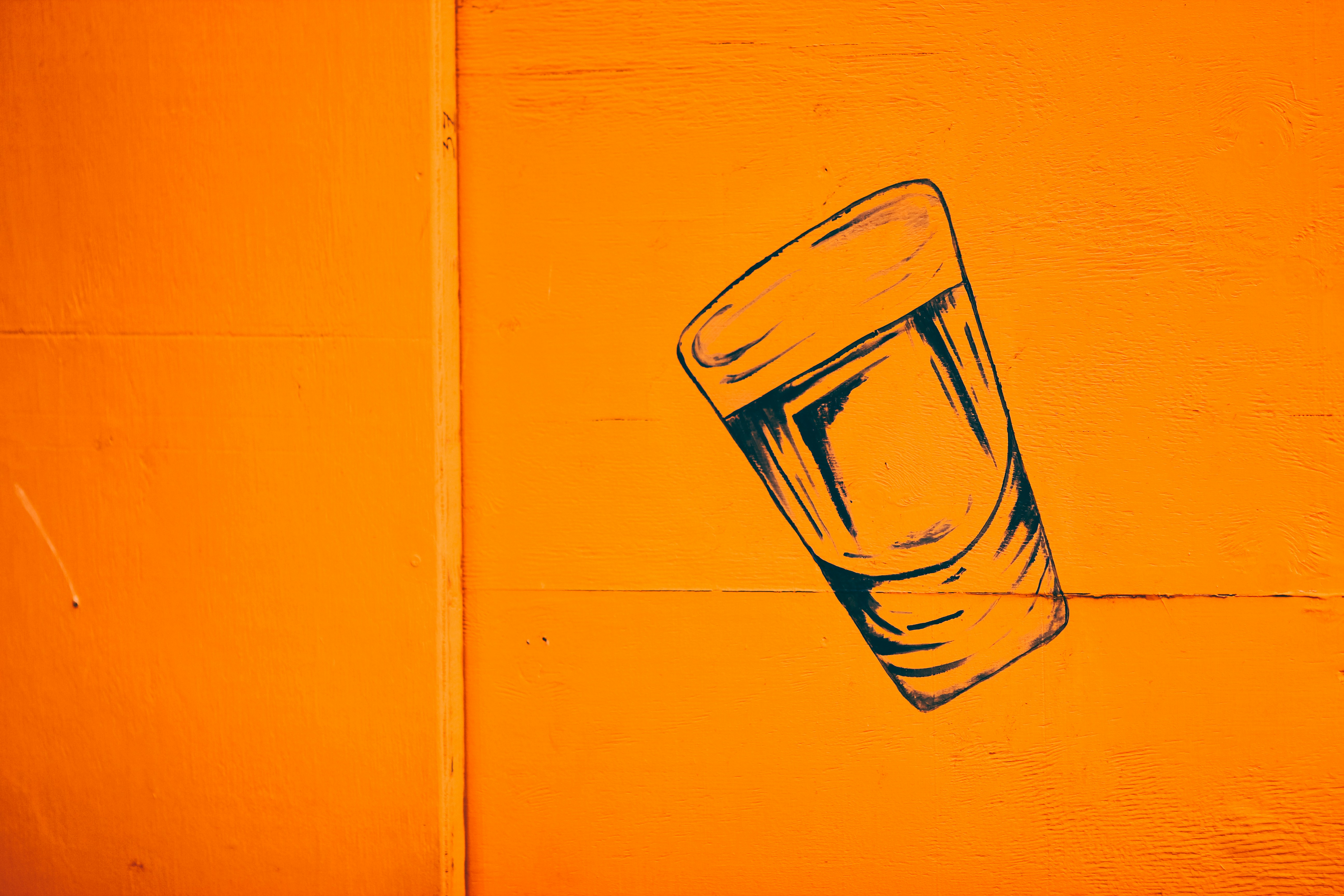 Diagonal Glass Sketch on a Tangerine Wall