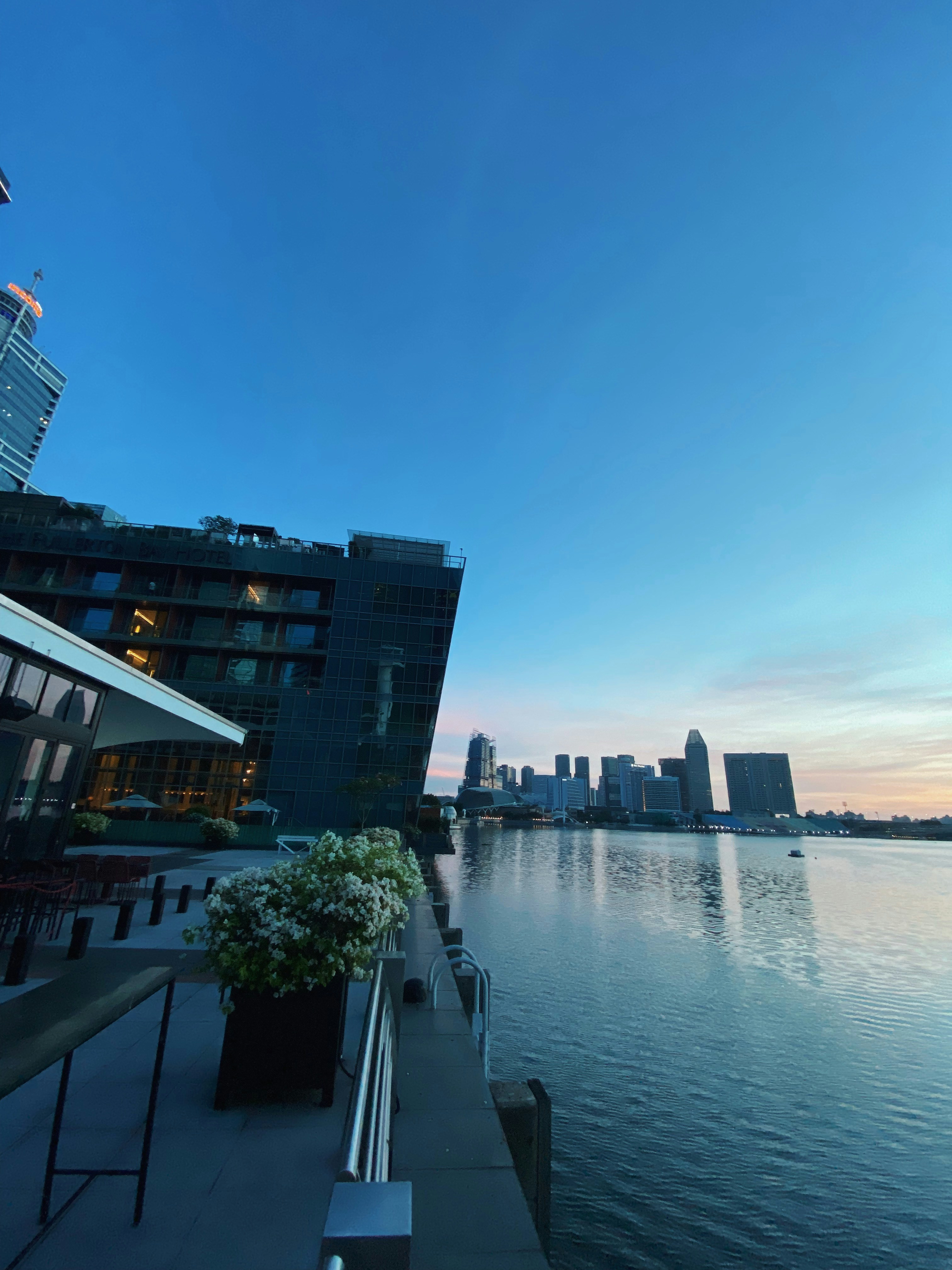 High rise buildings near body of water during daytime photo – Free ...