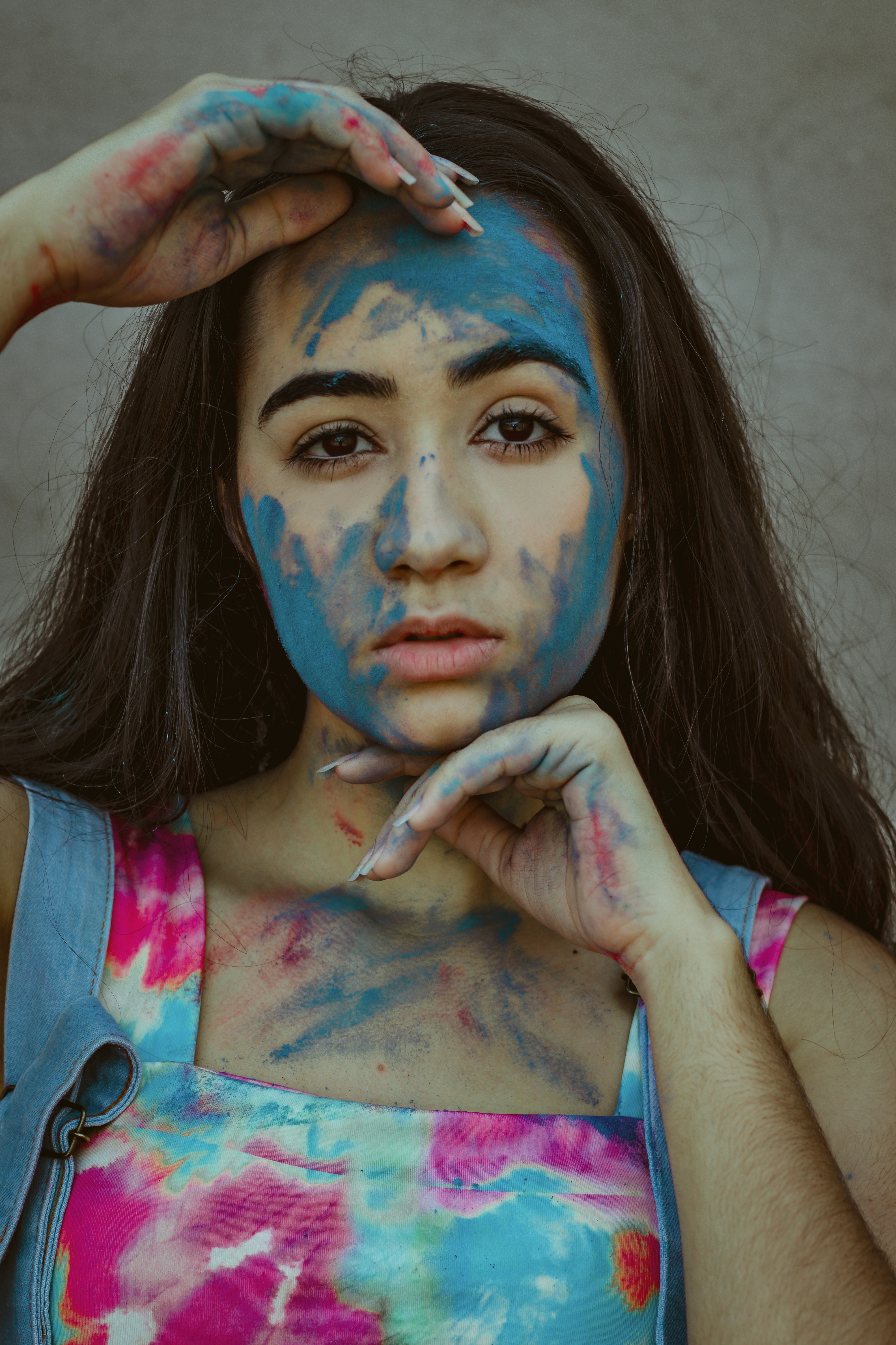 Woman in pink and blue tank top with blue face paint photo – Free ...