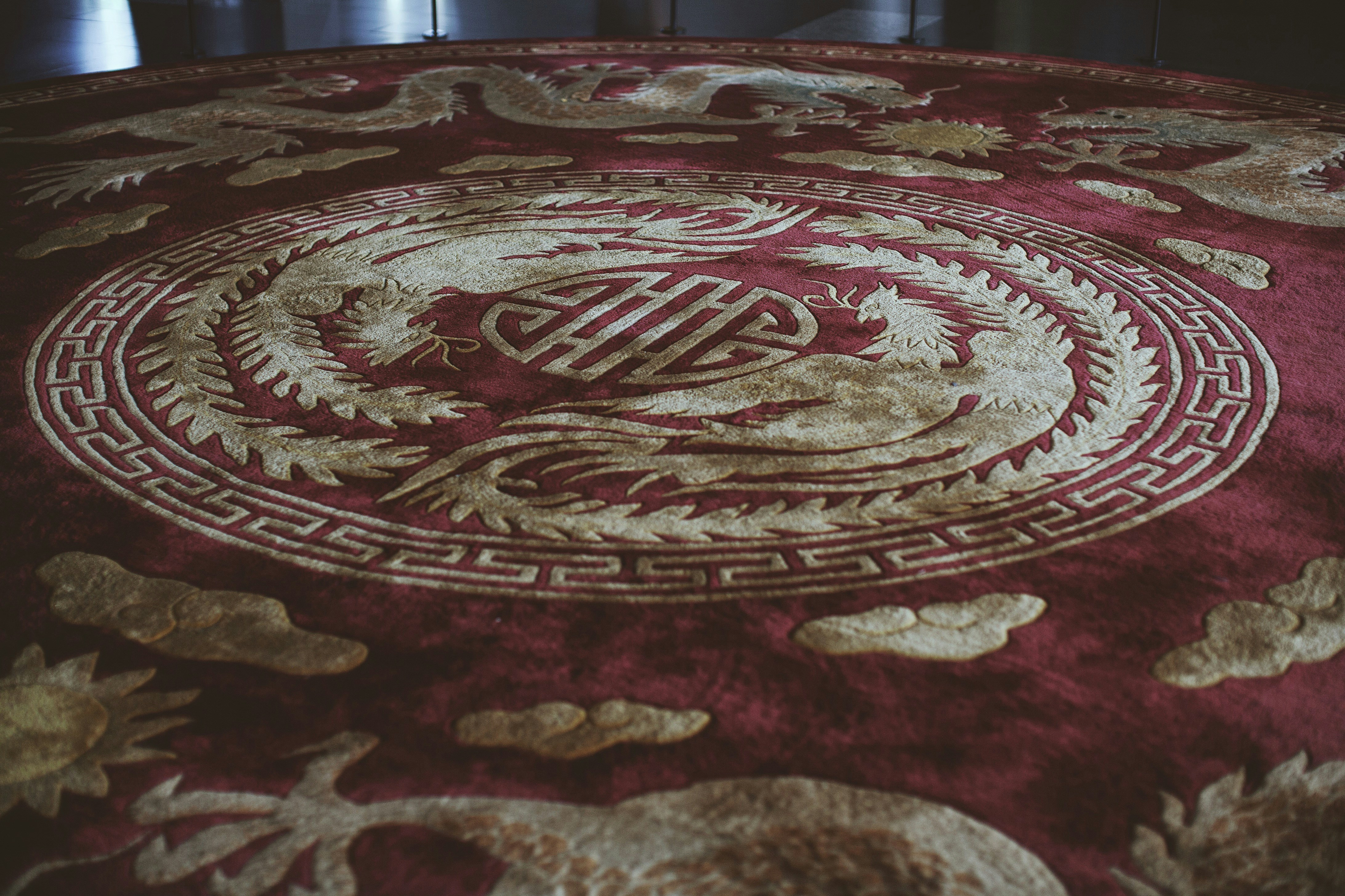 Dragon's Circular Crest on Crimson Velvet Carpet