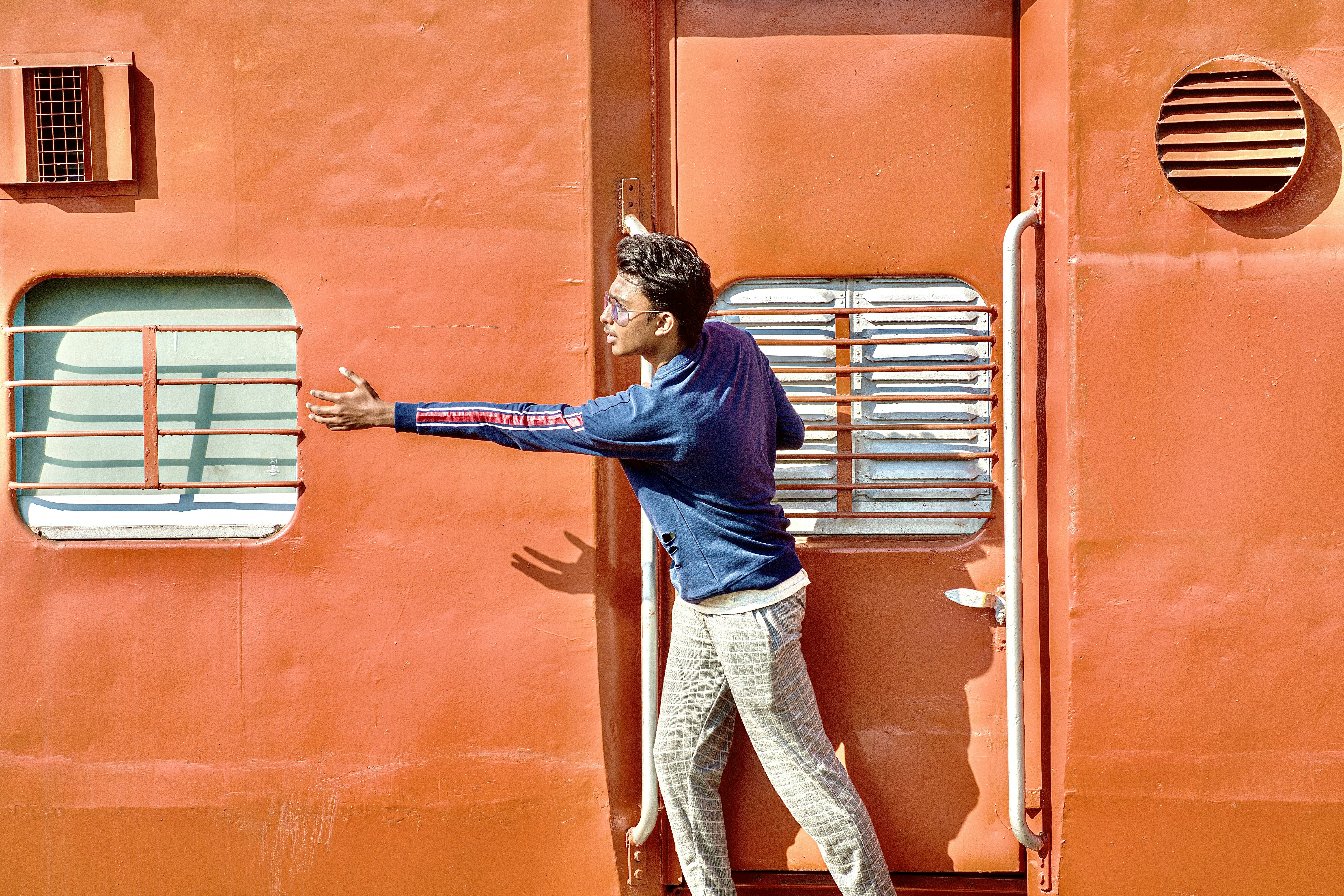 Running toward the doorway on a vivid orange wall