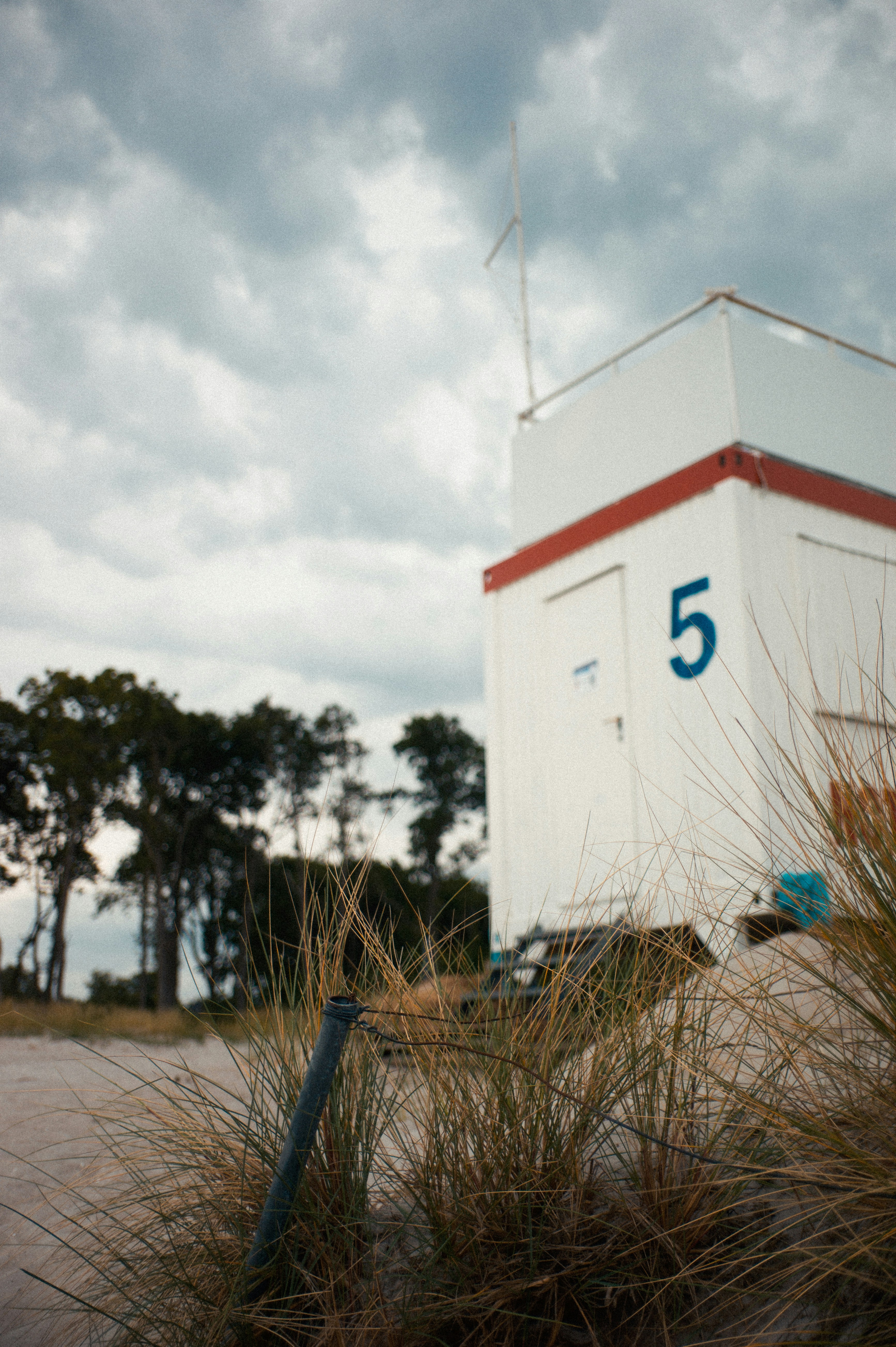 Coastal Lifeguard Tower at Dune Edge under a Pensive Sky