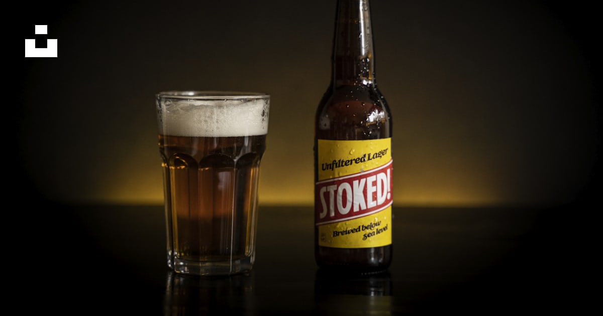 Yellow Labeled Bottle Beside Clear Drinking Glass Photo Free Beer