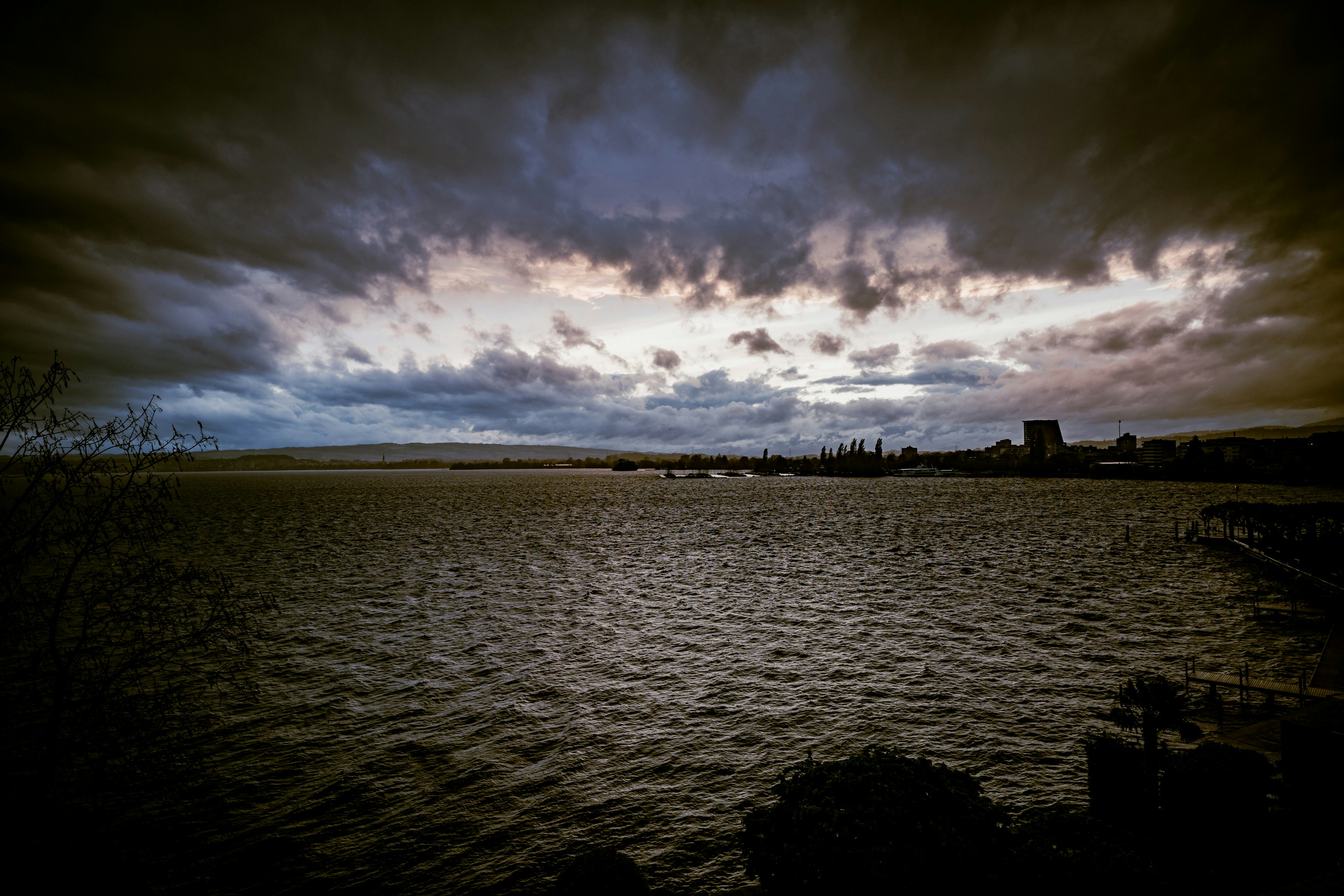 Moody evening on the lake - See more of Aleks Marinkovic's work at http://aleksmarinkovic.com and on instagram http://instagram.com/baronmarinkovic | body of water under cloudy sky during daytime