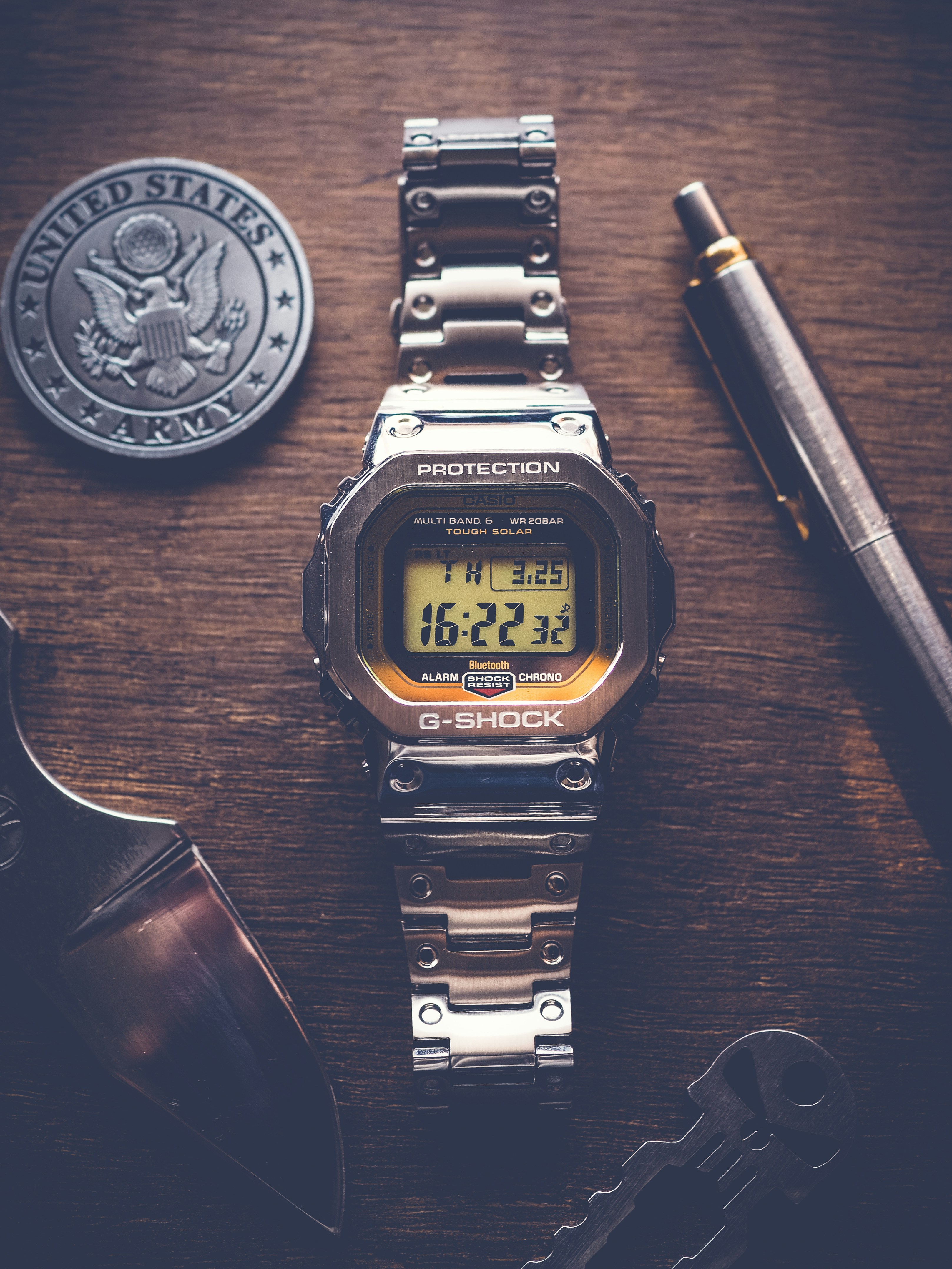 silver and black casio digital watch at 7 00