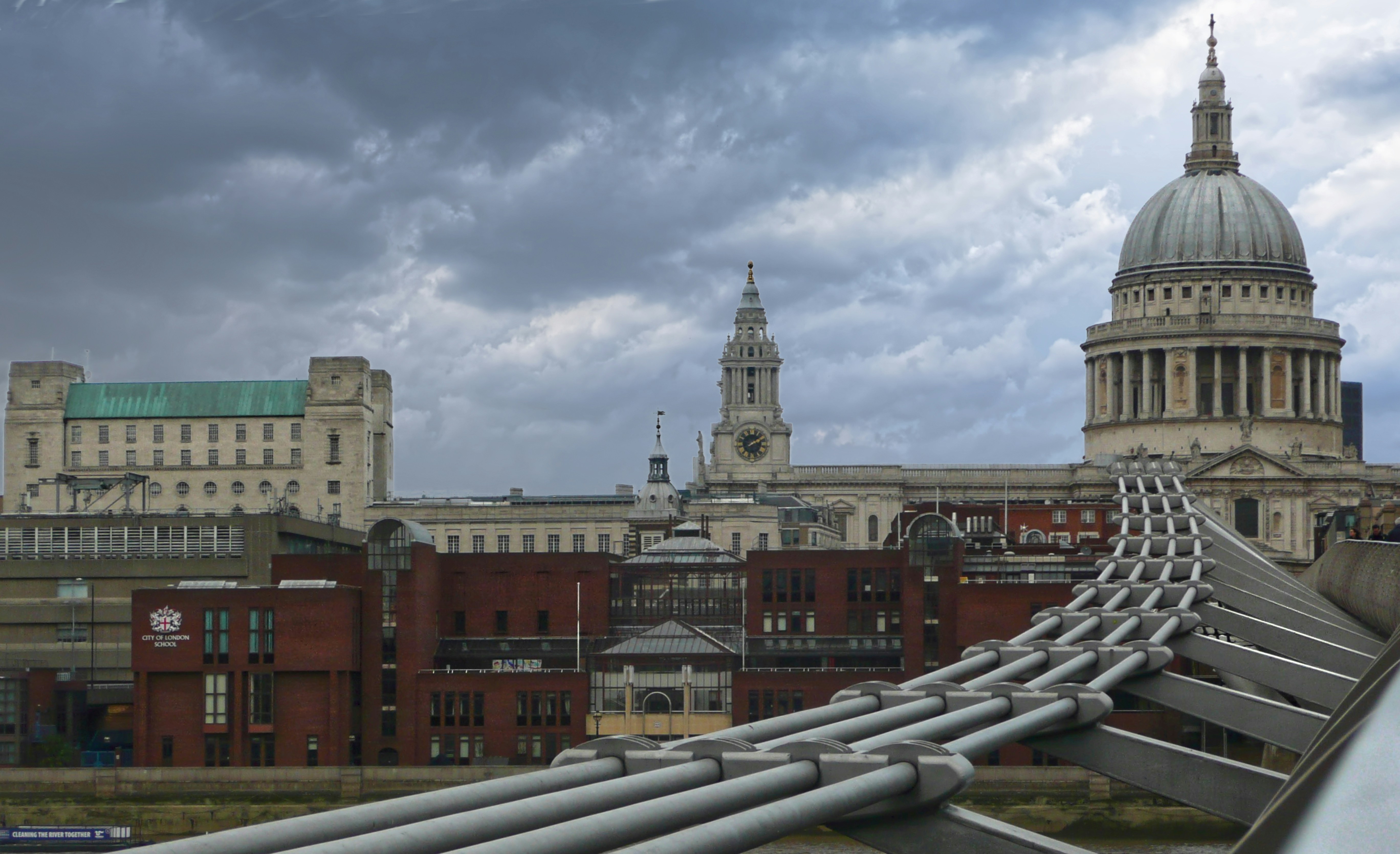 Black metal tube near red concrete building during daytime photo – Free ...