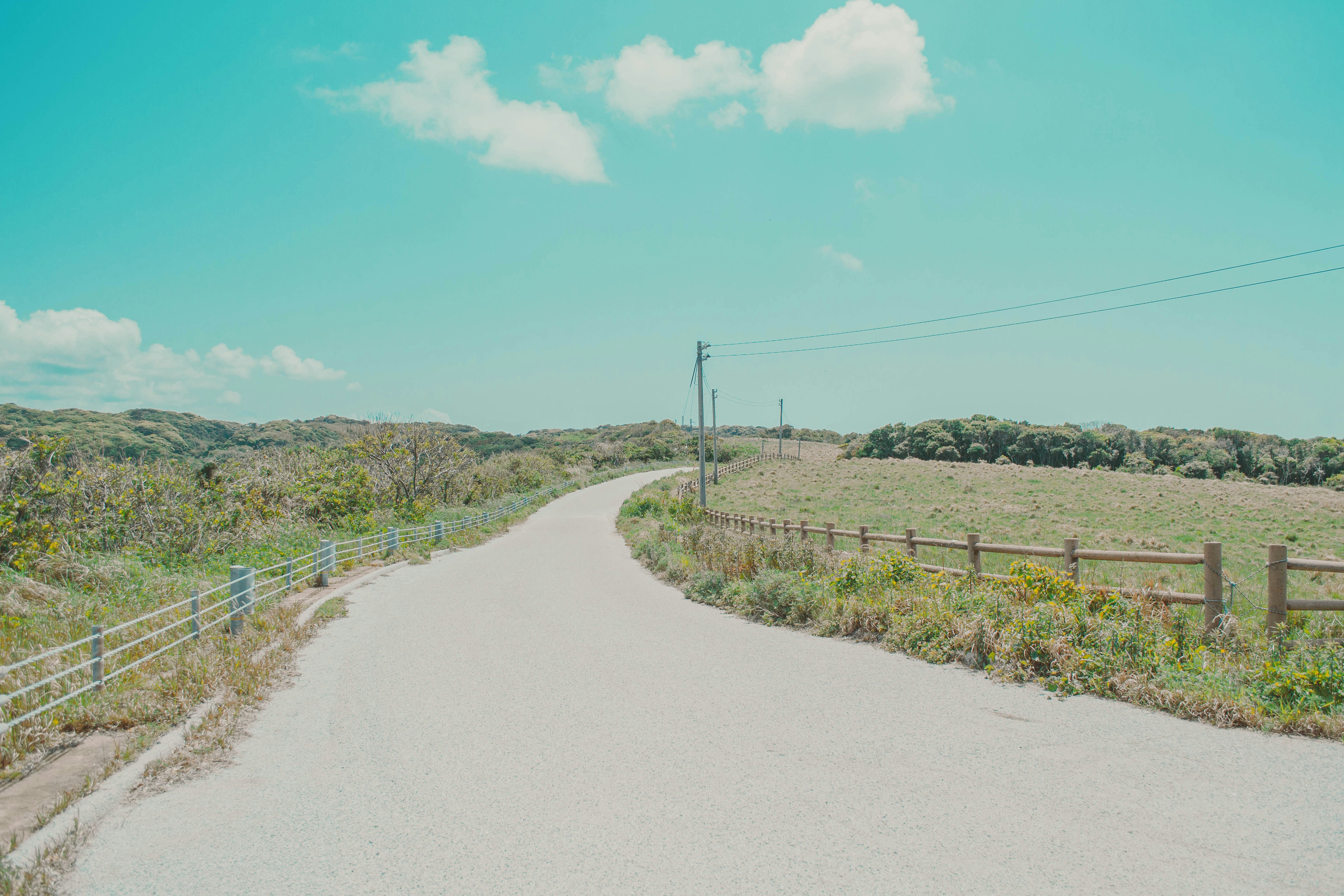 Dusty Rural Pathway Bending Toward Horizon