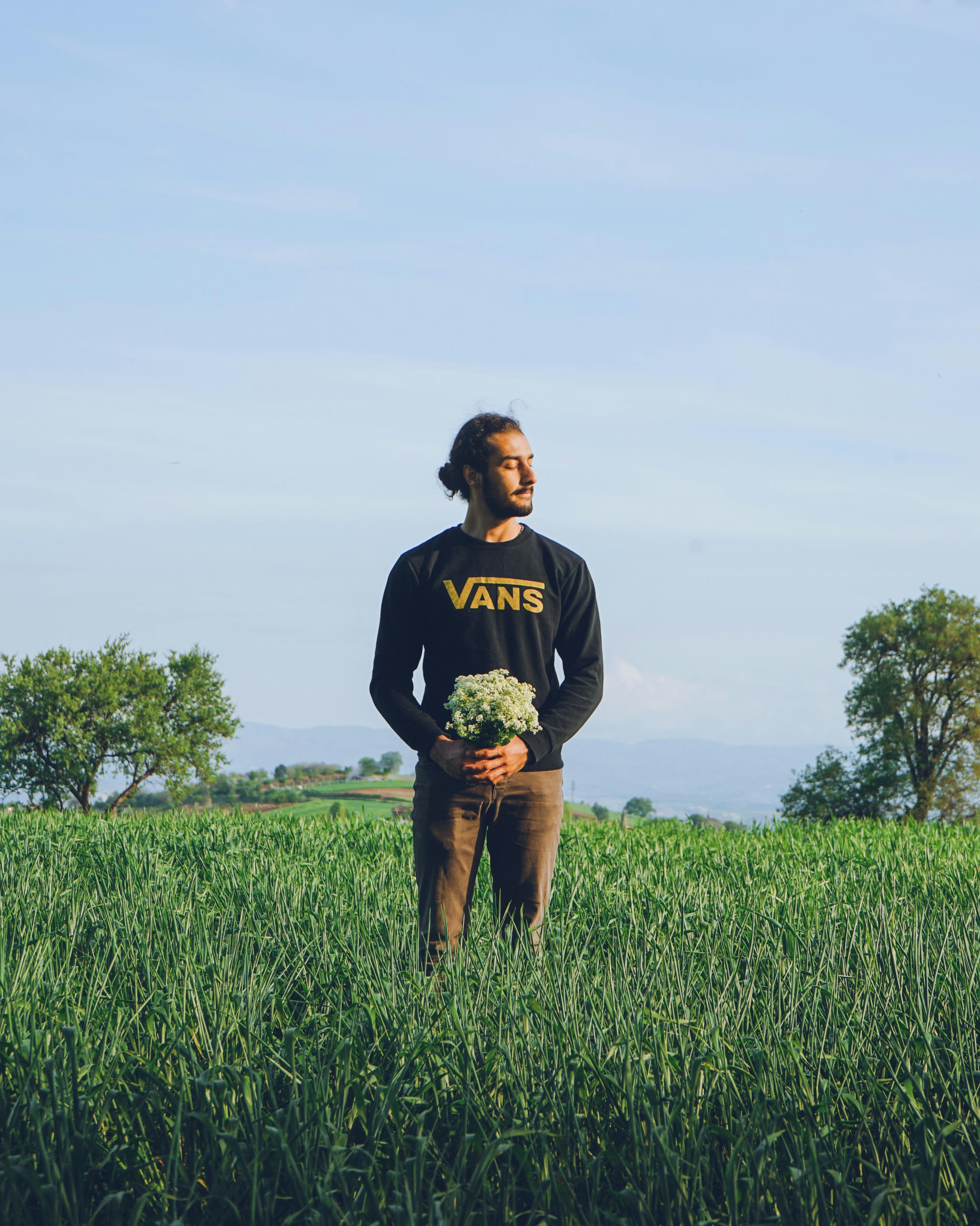 Field of Moments: A Portrait Amid Tall Grass and Open Sky