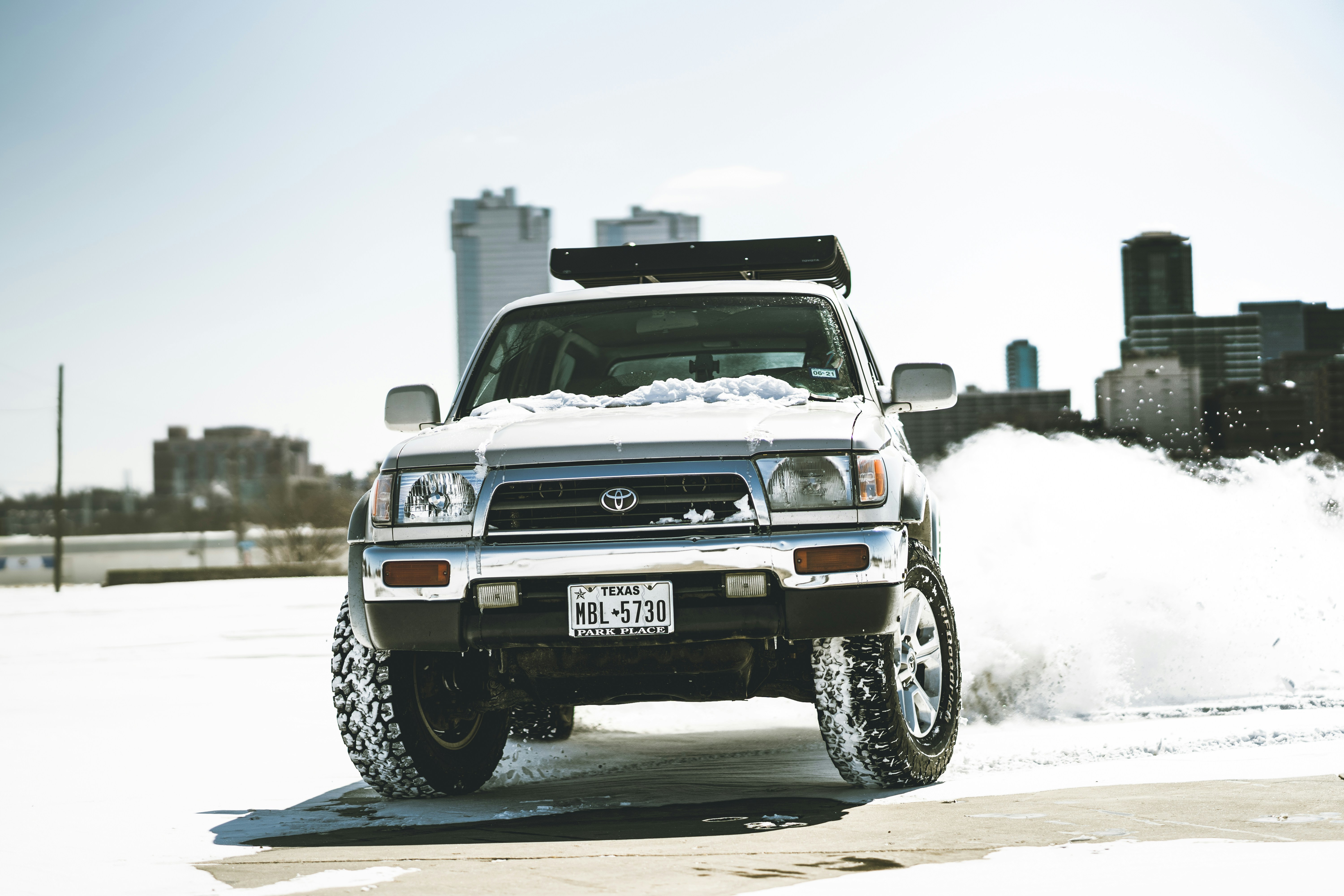 Urban Adventure: SUV Conquers the Snowy Cityscape