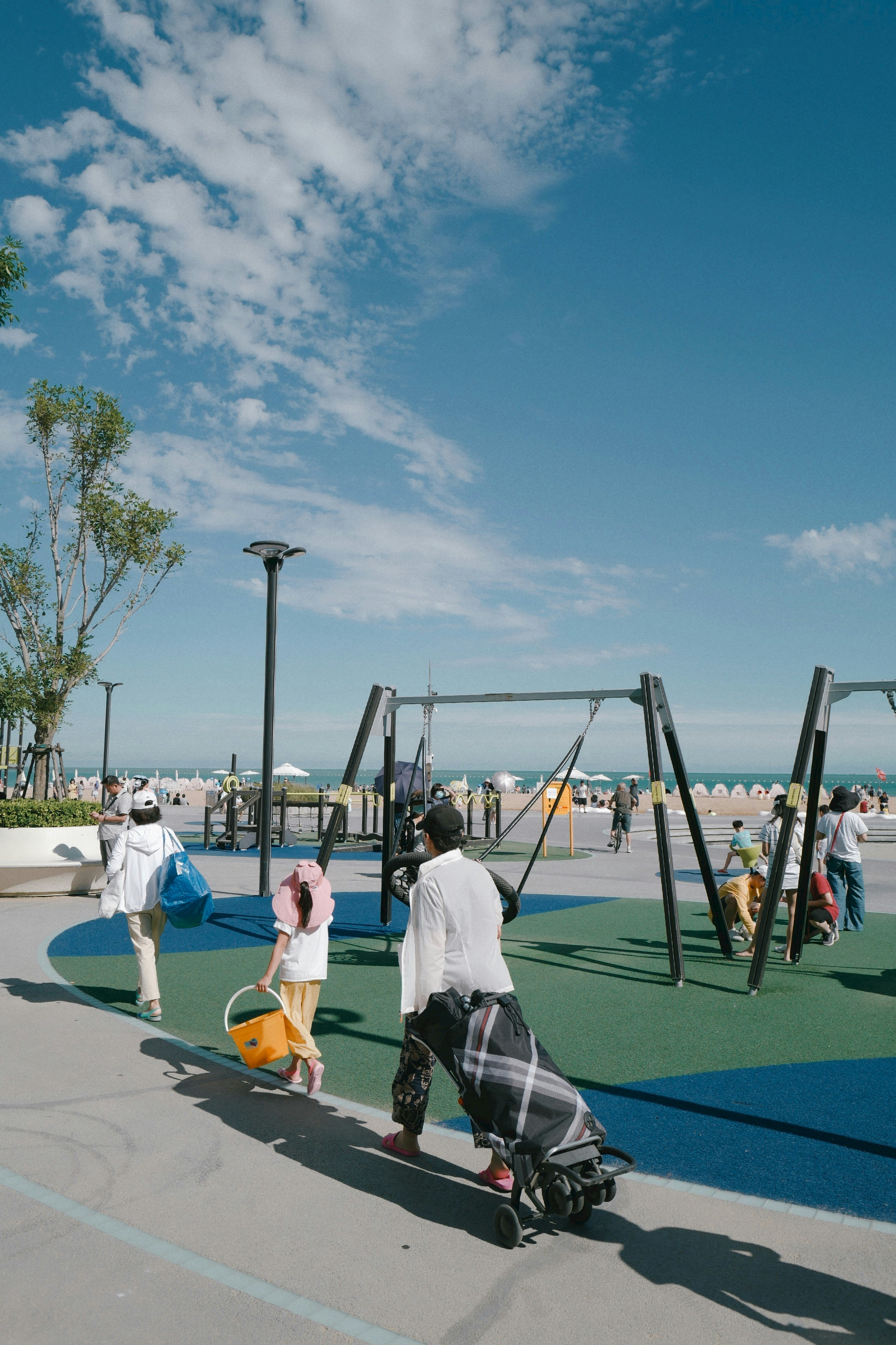 Wind, Wheels, and Waves: A Sunlit Beachfront Playground