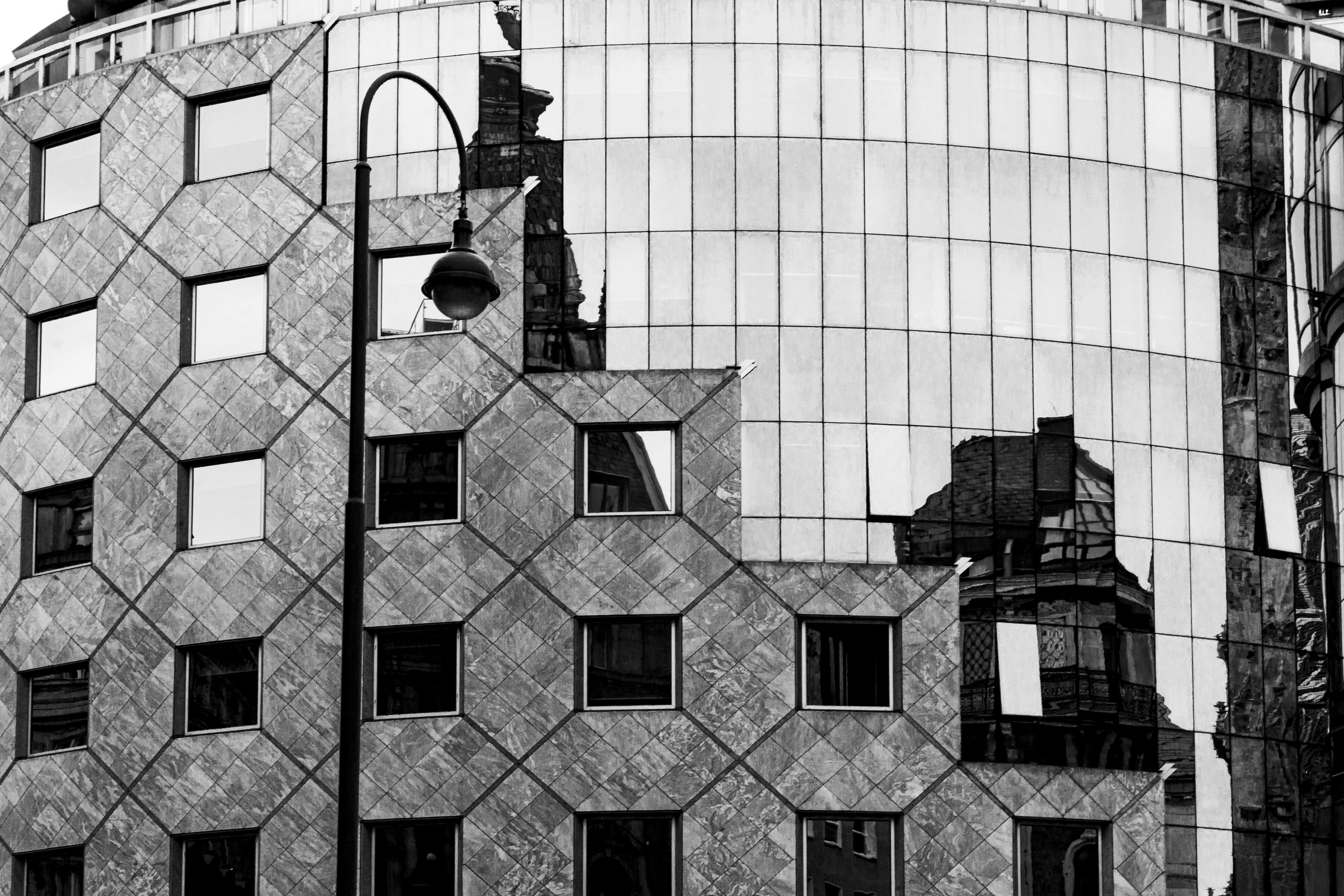 Facet Mosaic: A City Facade Reimagined in Glass and Stone