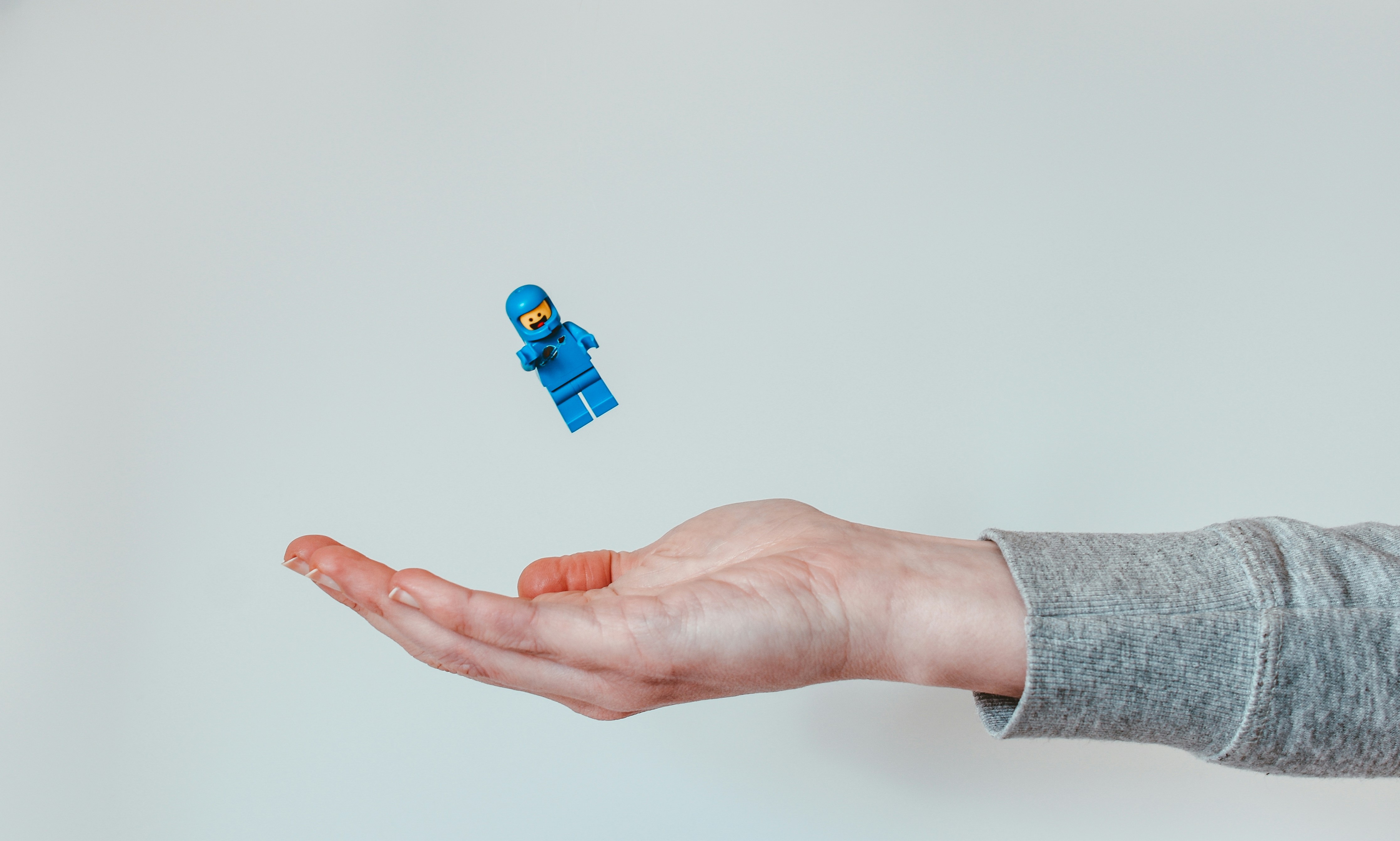 Person holding blue lego toy photo – Free Hand Image on Unsplash
