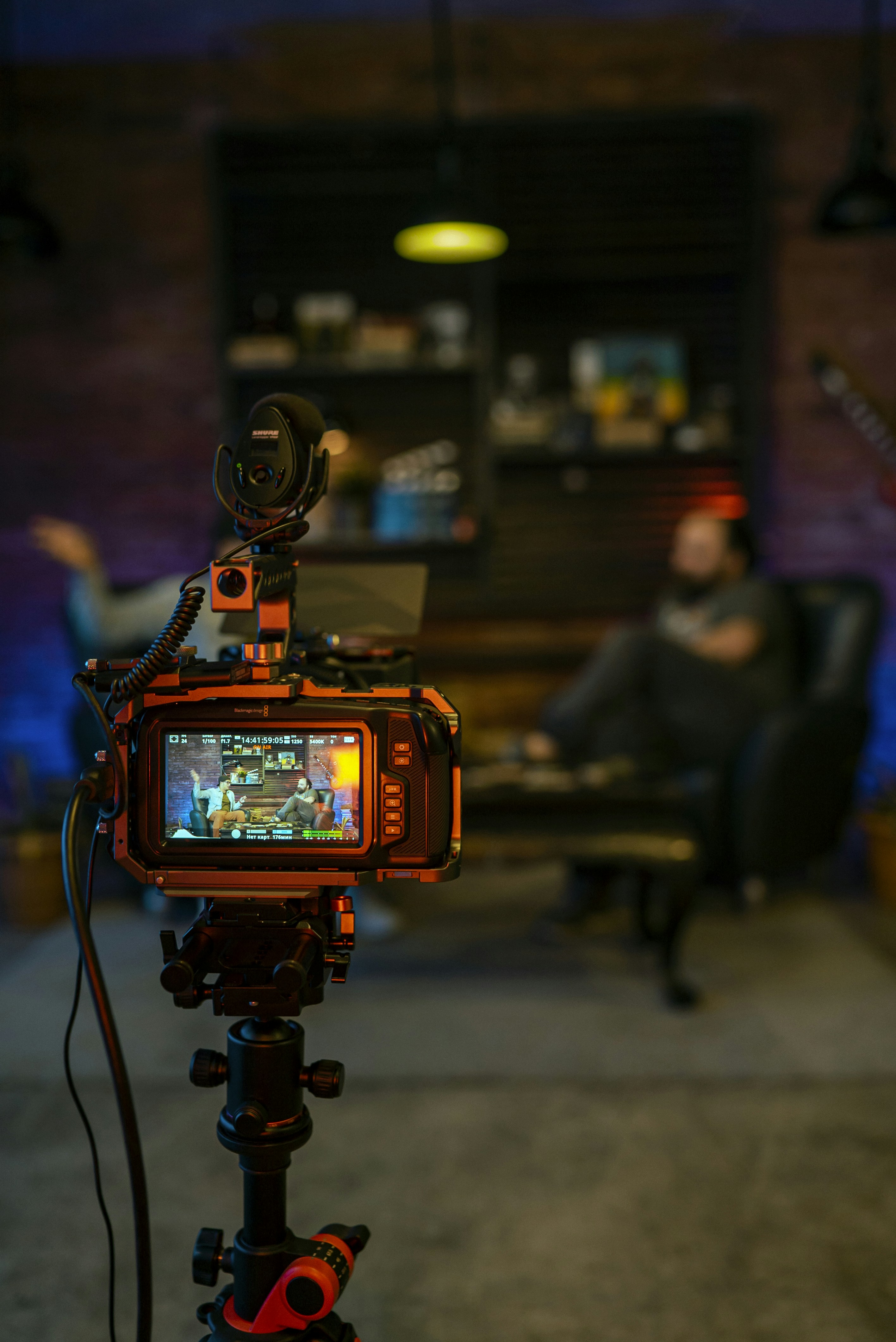 Black and orange camera on black tripod photo – Free Filmmaker gear ...