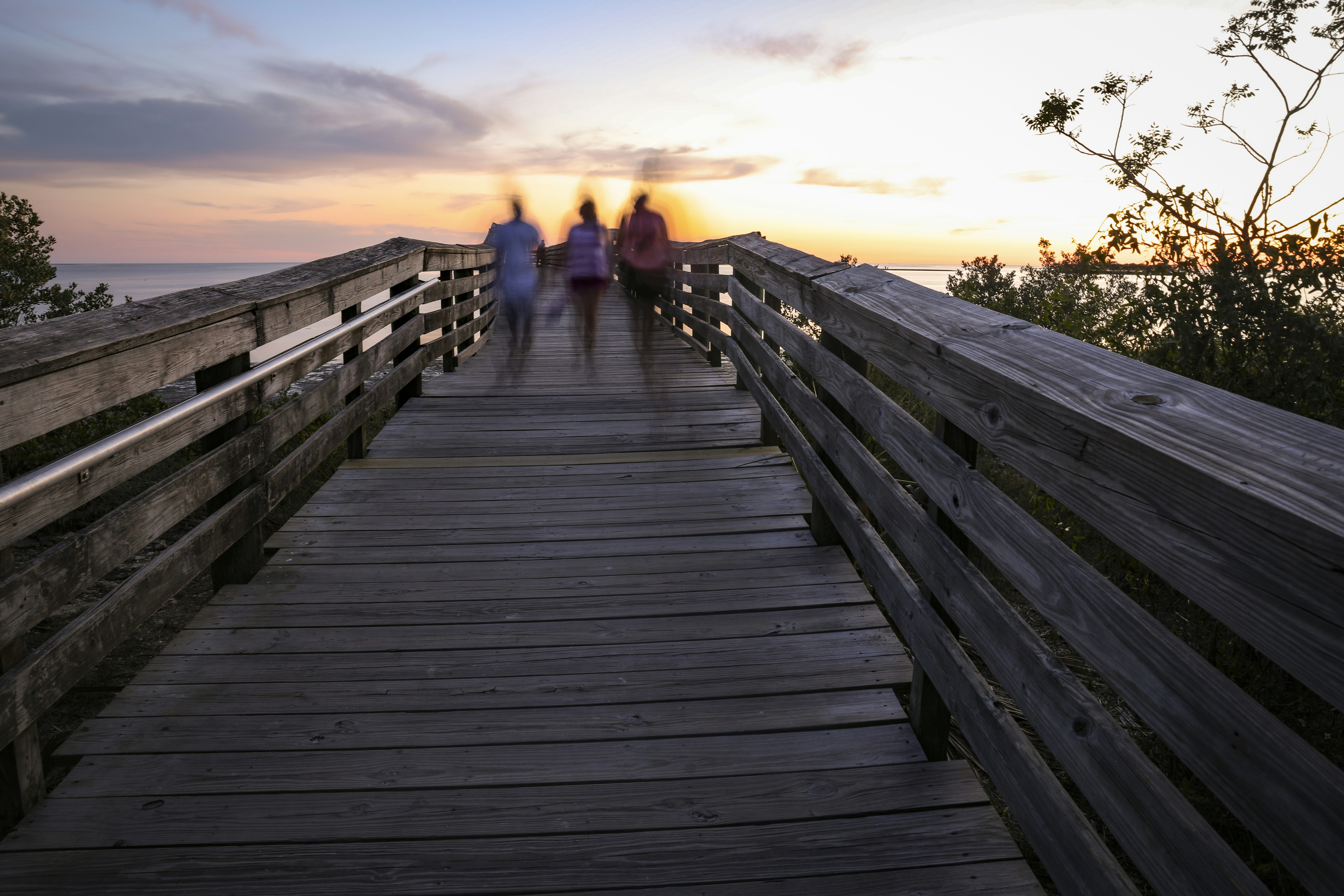Horizon Bound: Sunset on the Weathered Boardwalk