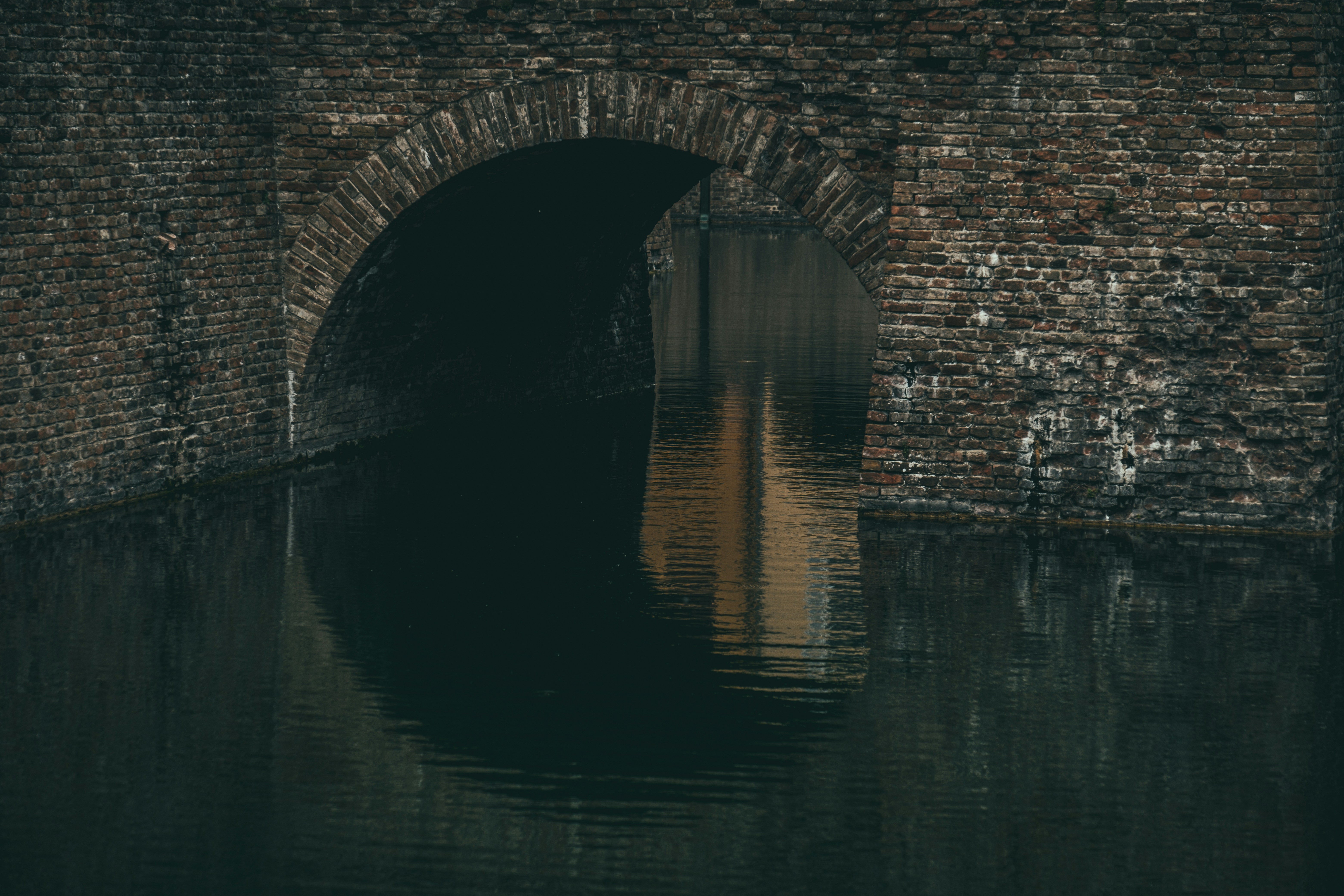 Brown brick bridge over water photo – Free Black Image on Unsplash