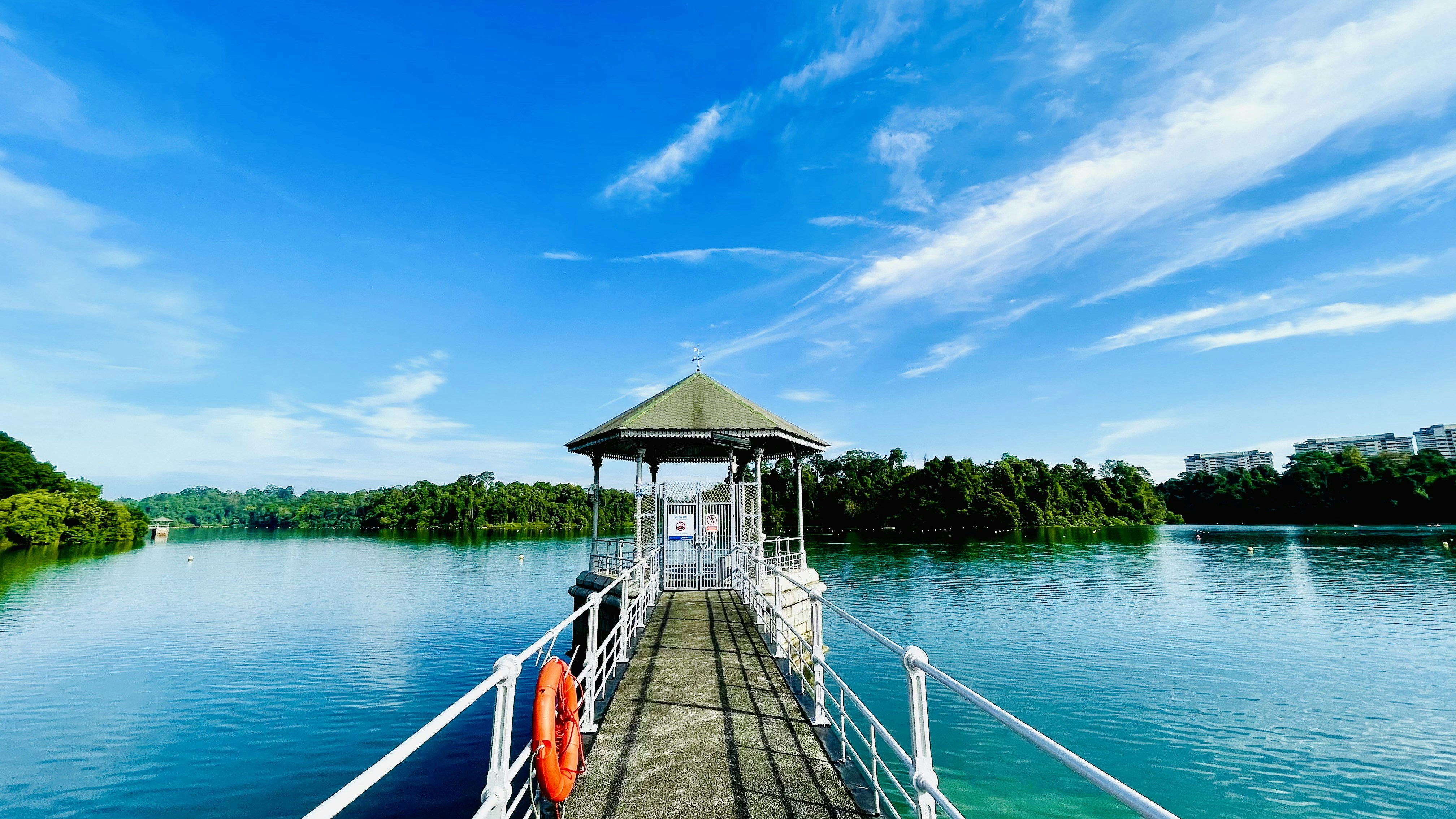 Azure Sky, Quiet Pier: The Lakefront Gazebo at the End of a Wooden Path
