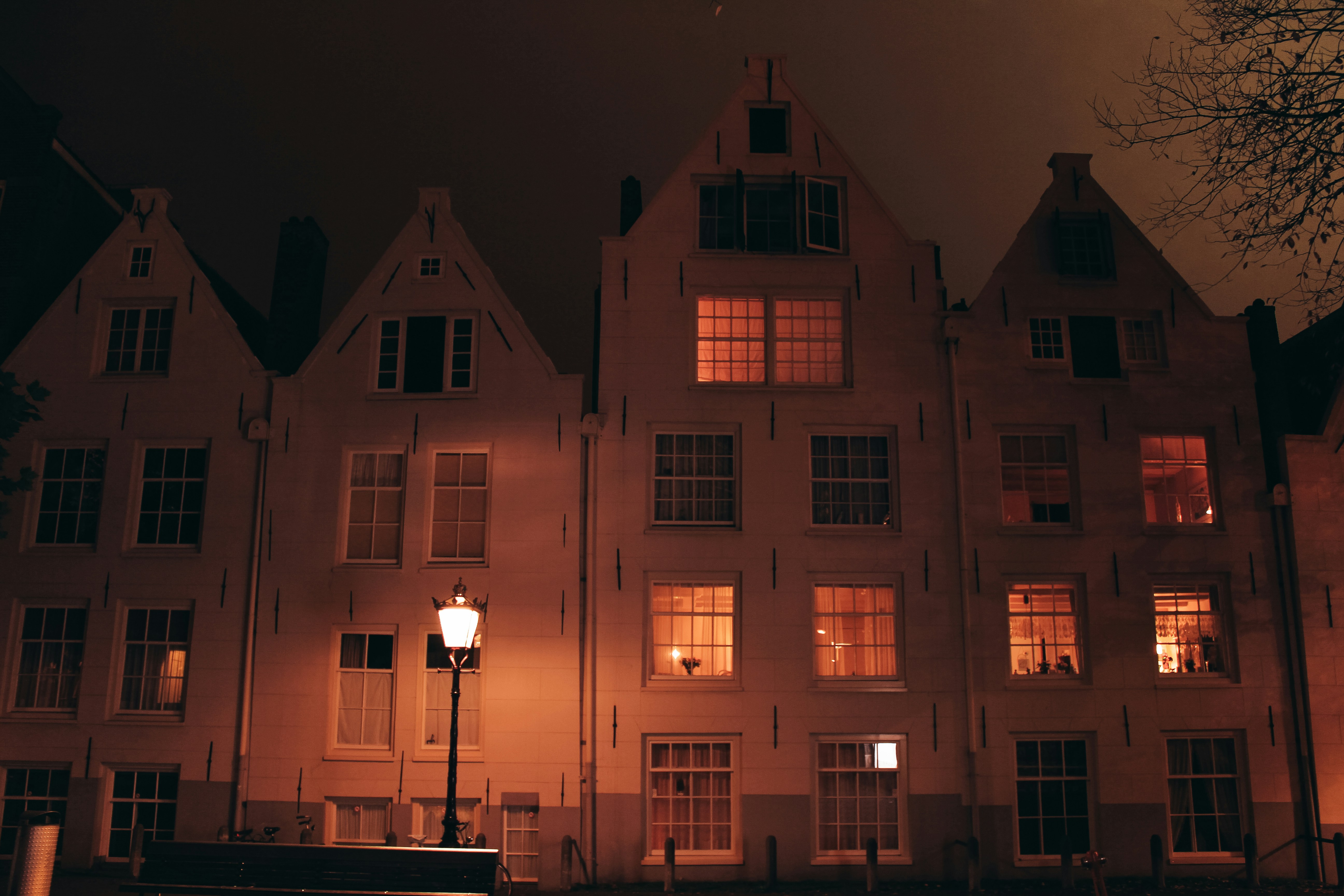 Warm-Glow Row: Nighttime Facade Bathed in Streetlamp Light