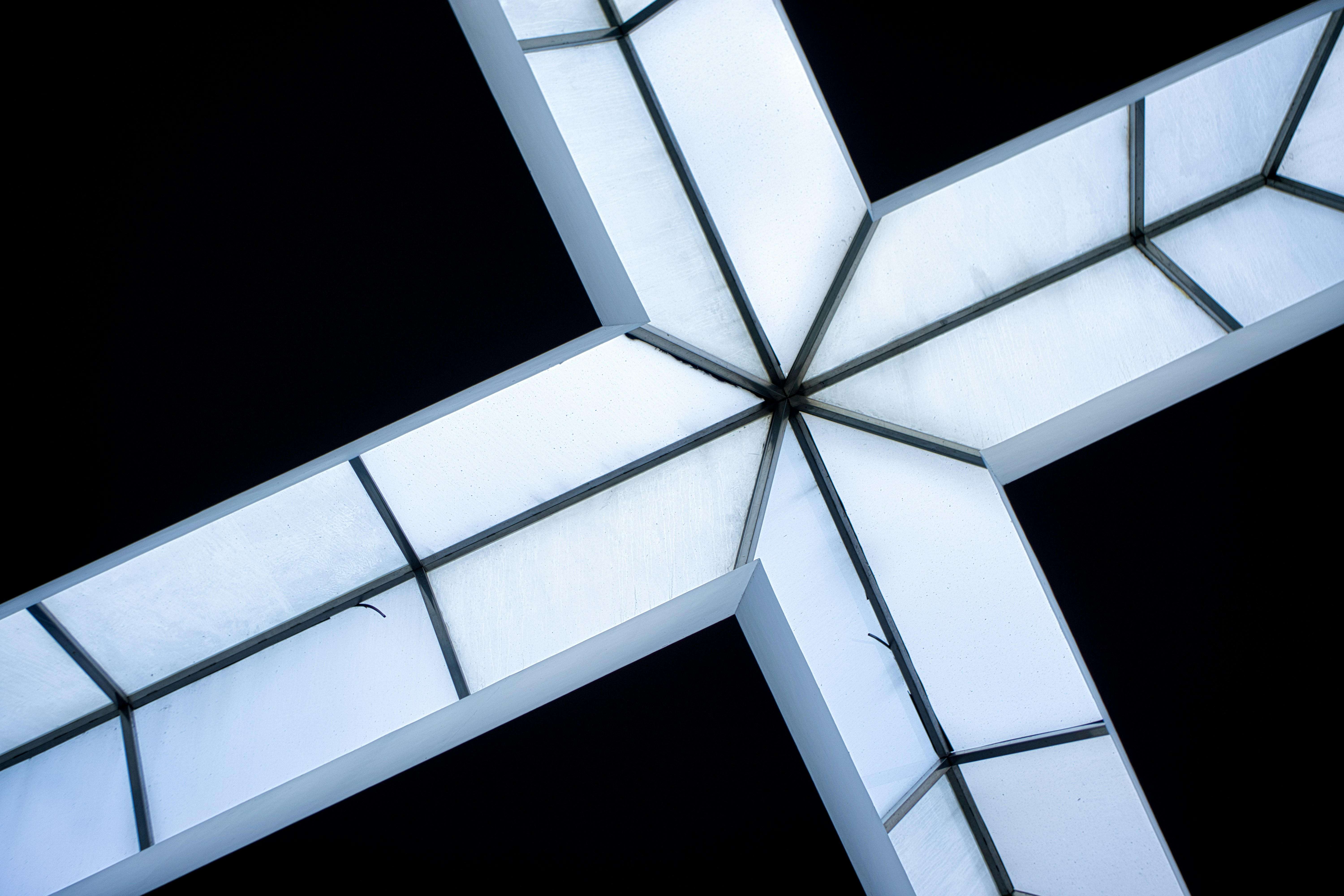Neon-Glass Cross: Nighttime Geometry in Blue-White Light