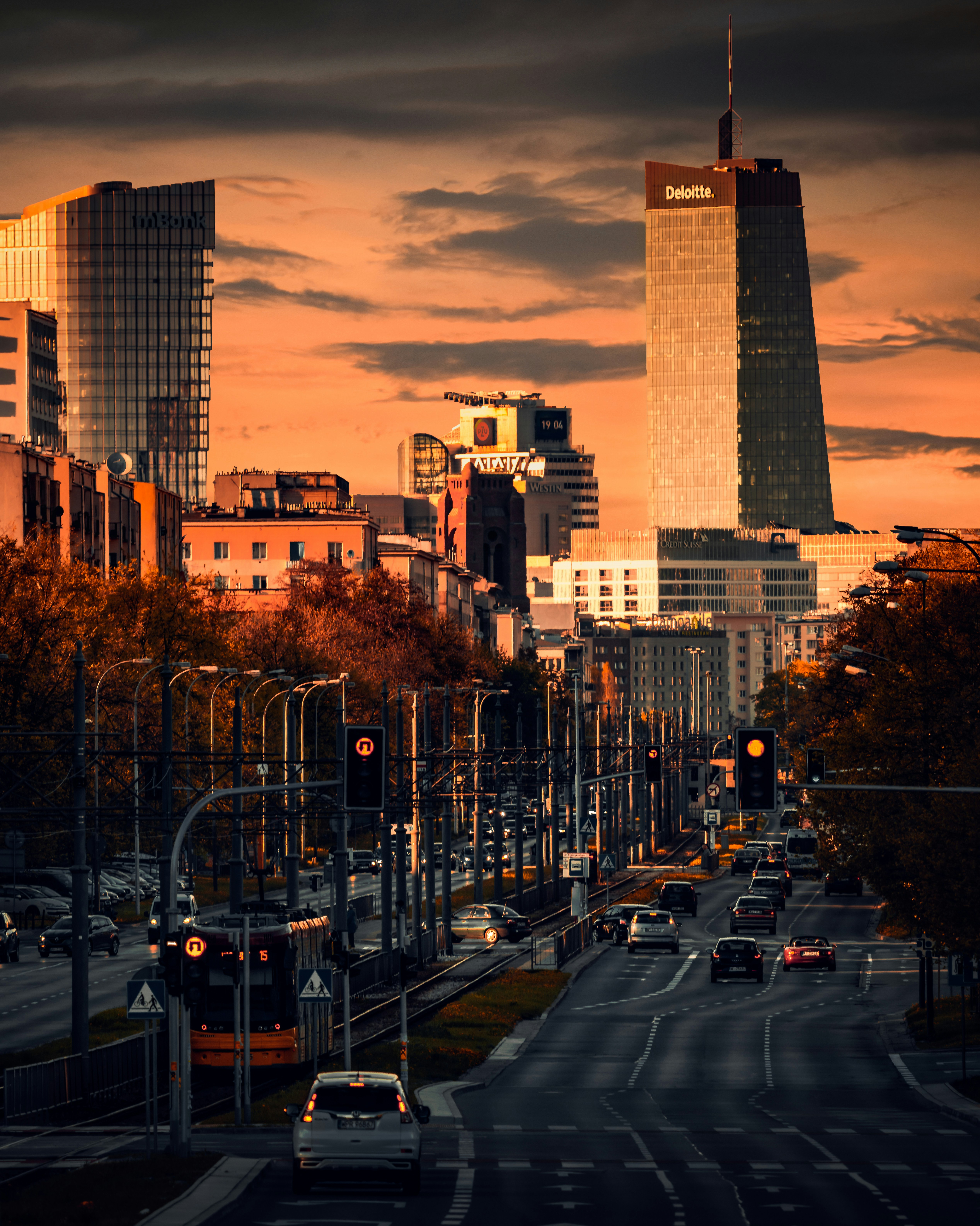 Dusk Corridor: Light, Trams, and the Deloitte Tower at Sunset