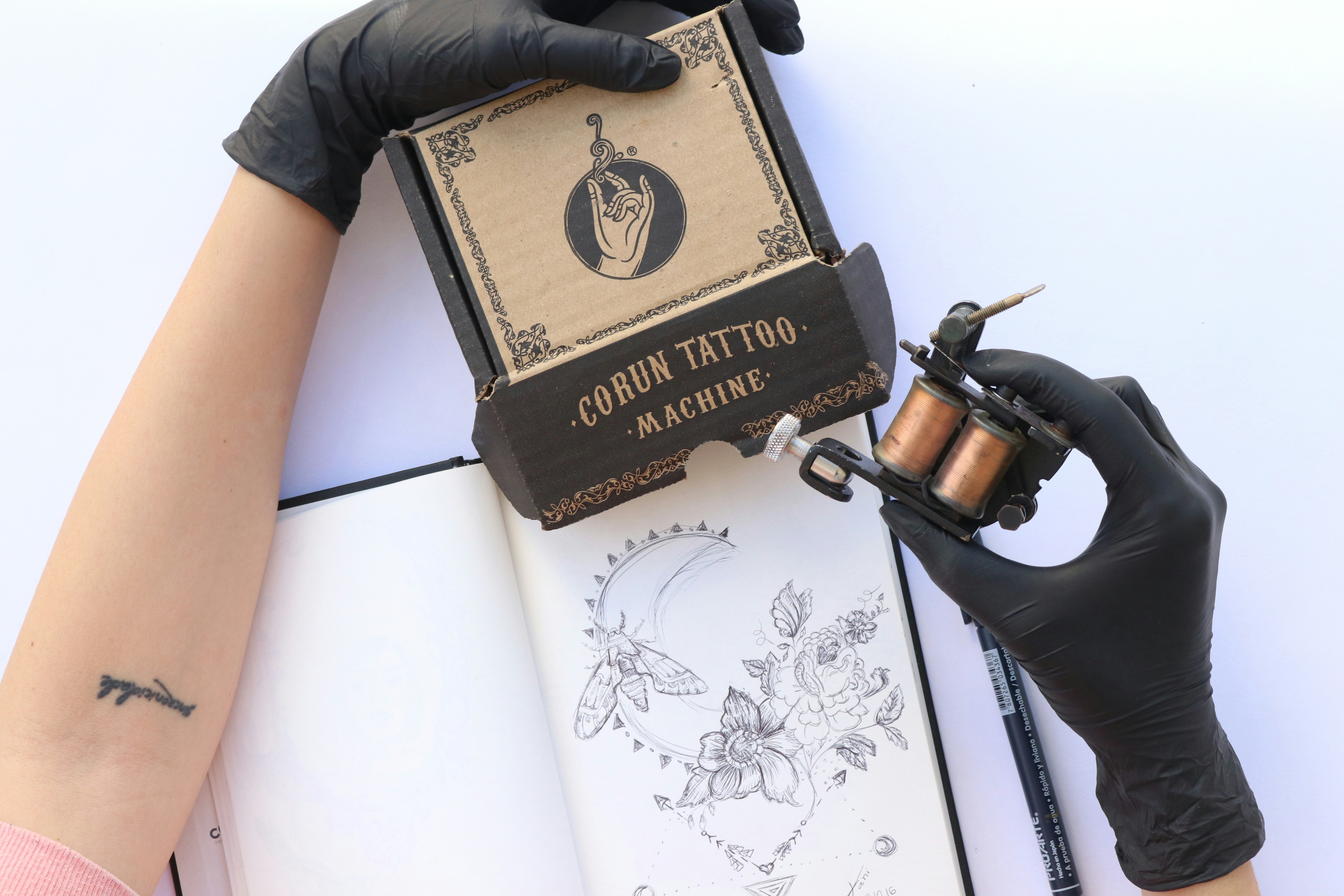 Person holding brown and black box photo – Free Tattoo Image on Unsplash