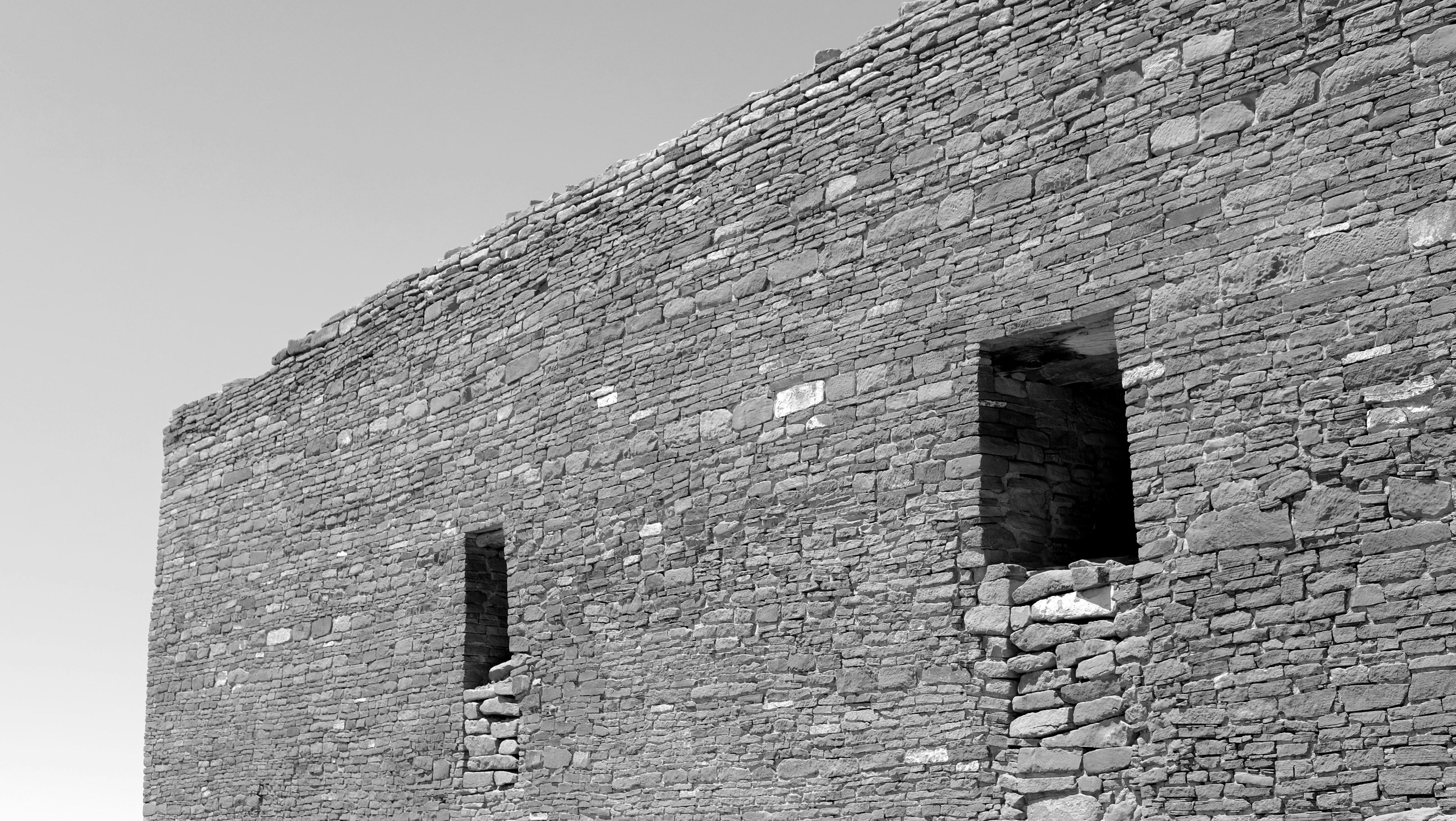 Grayscale photo of brick wall photo – Free Building Image on Unsplash