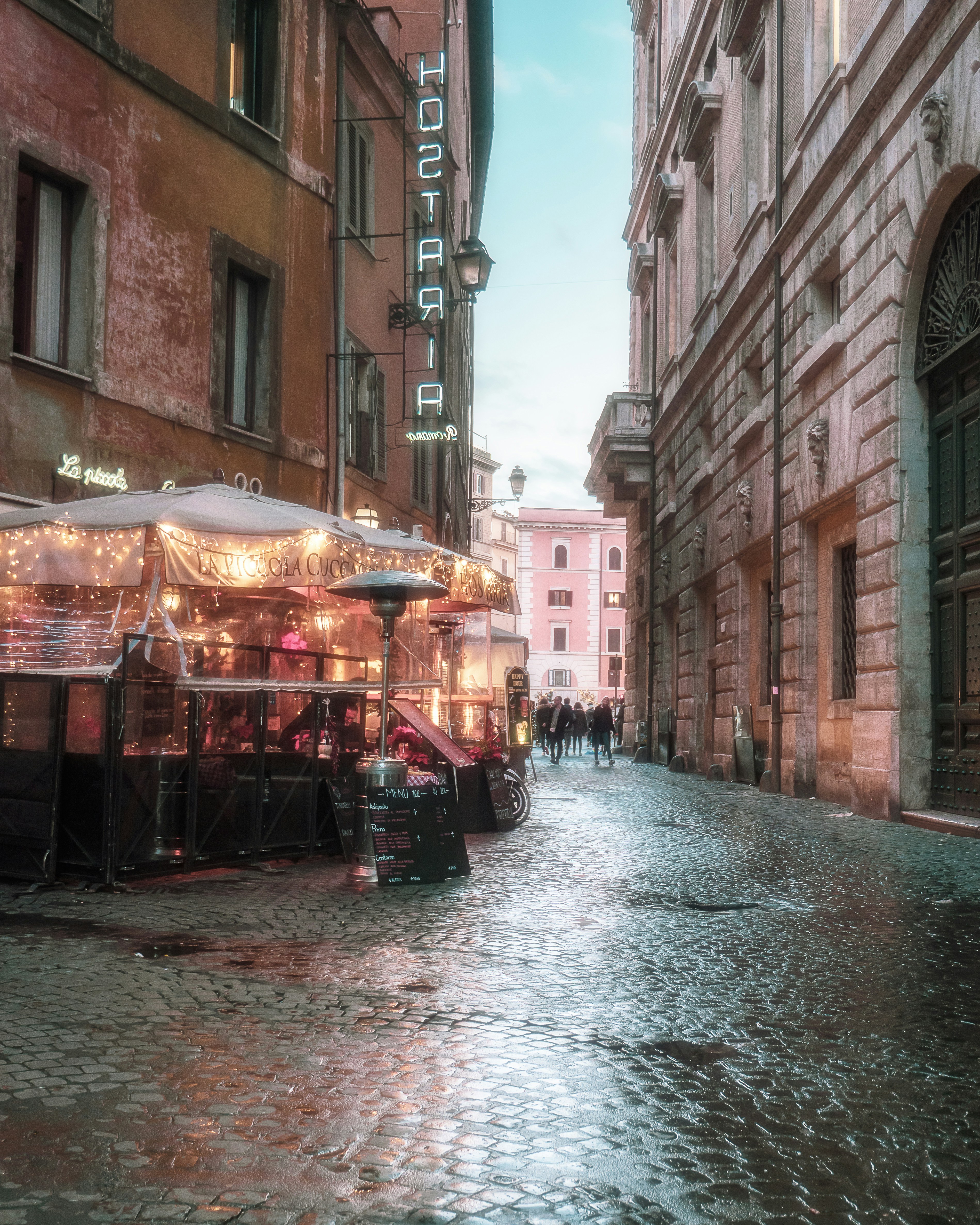 Whispers of Warm Light on a Rain-Wet European Lane