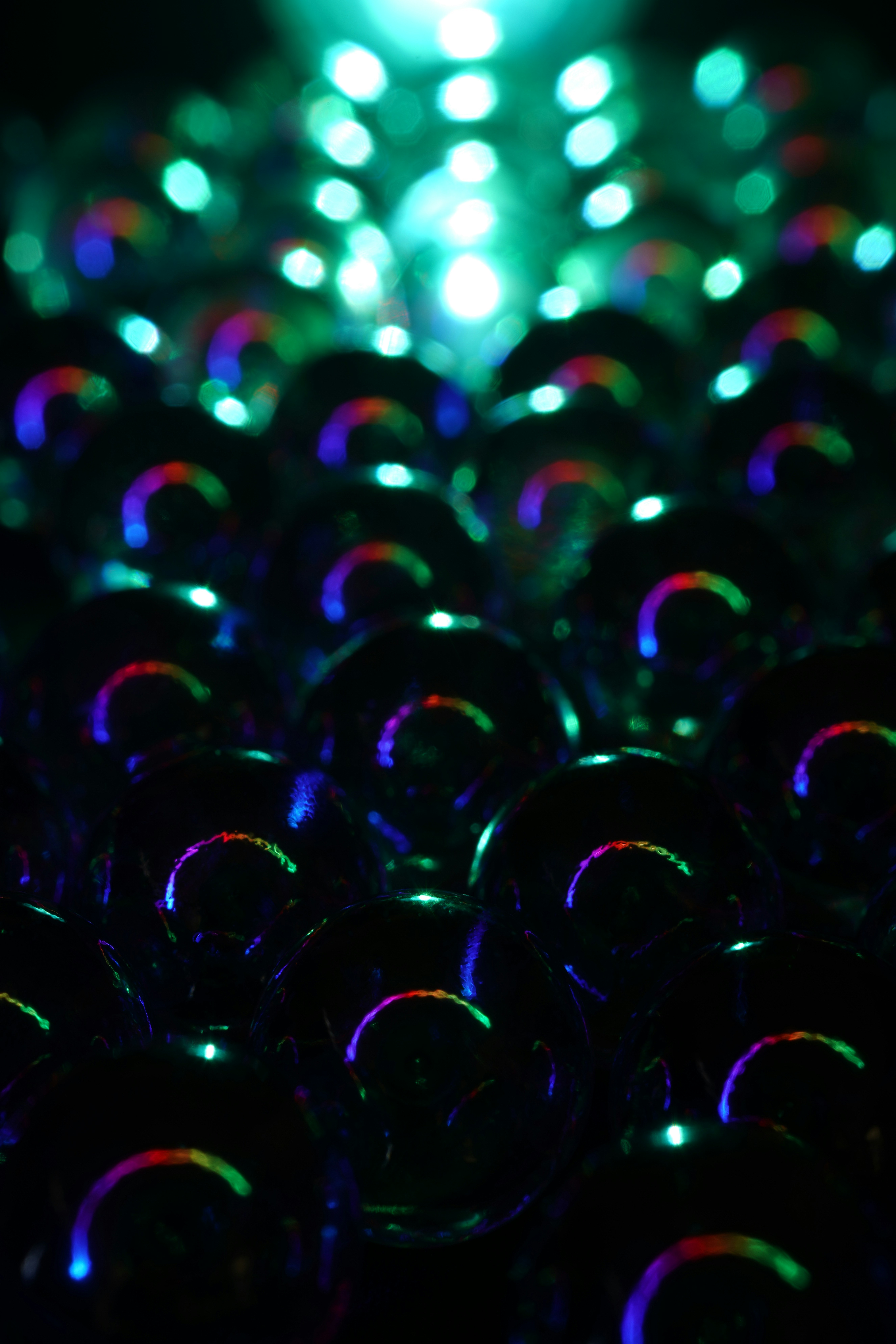 Luminous Orbs in a Midnight Sea of Glass