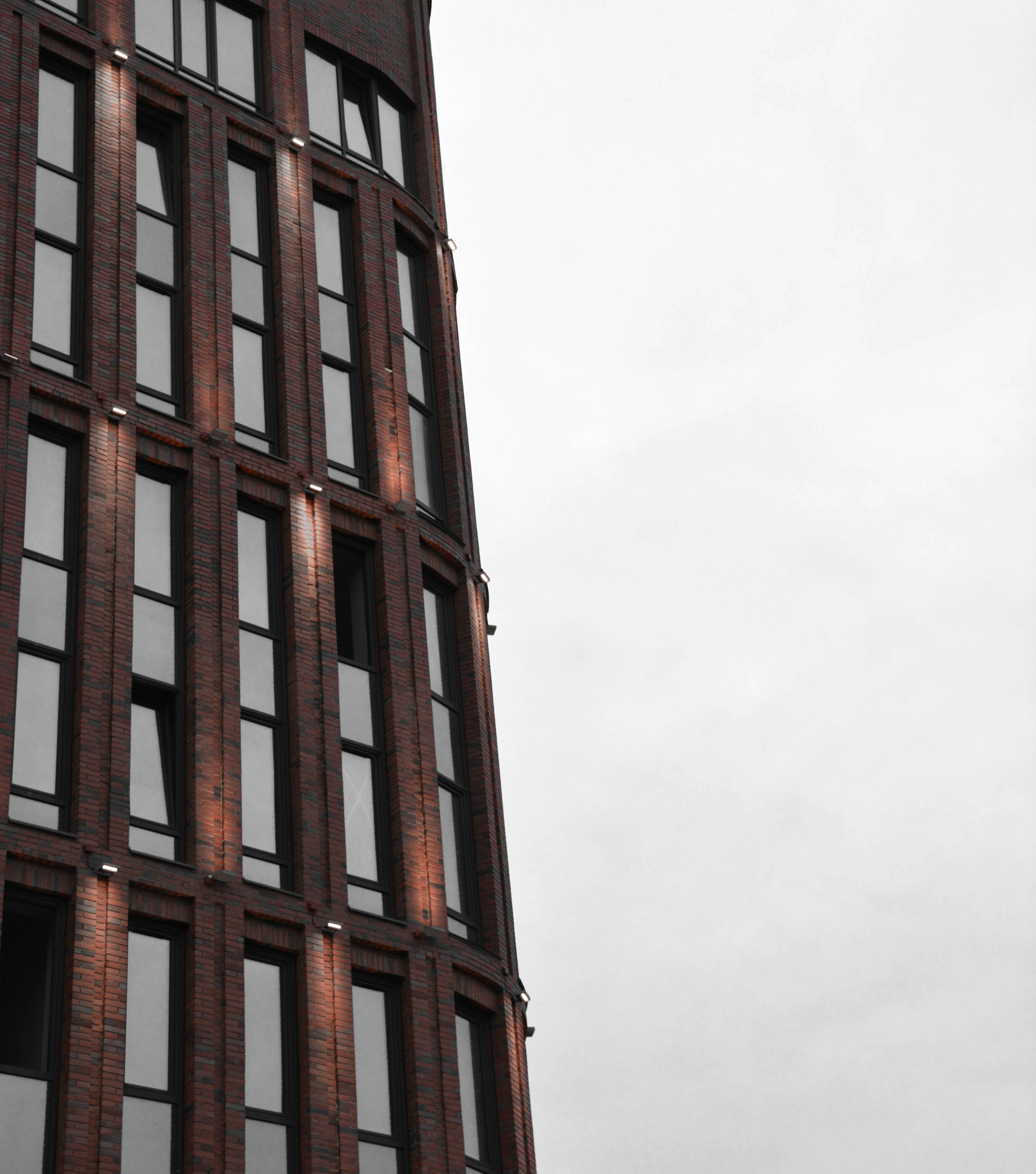 Brick Facade Reaching Toward a Grey Sky