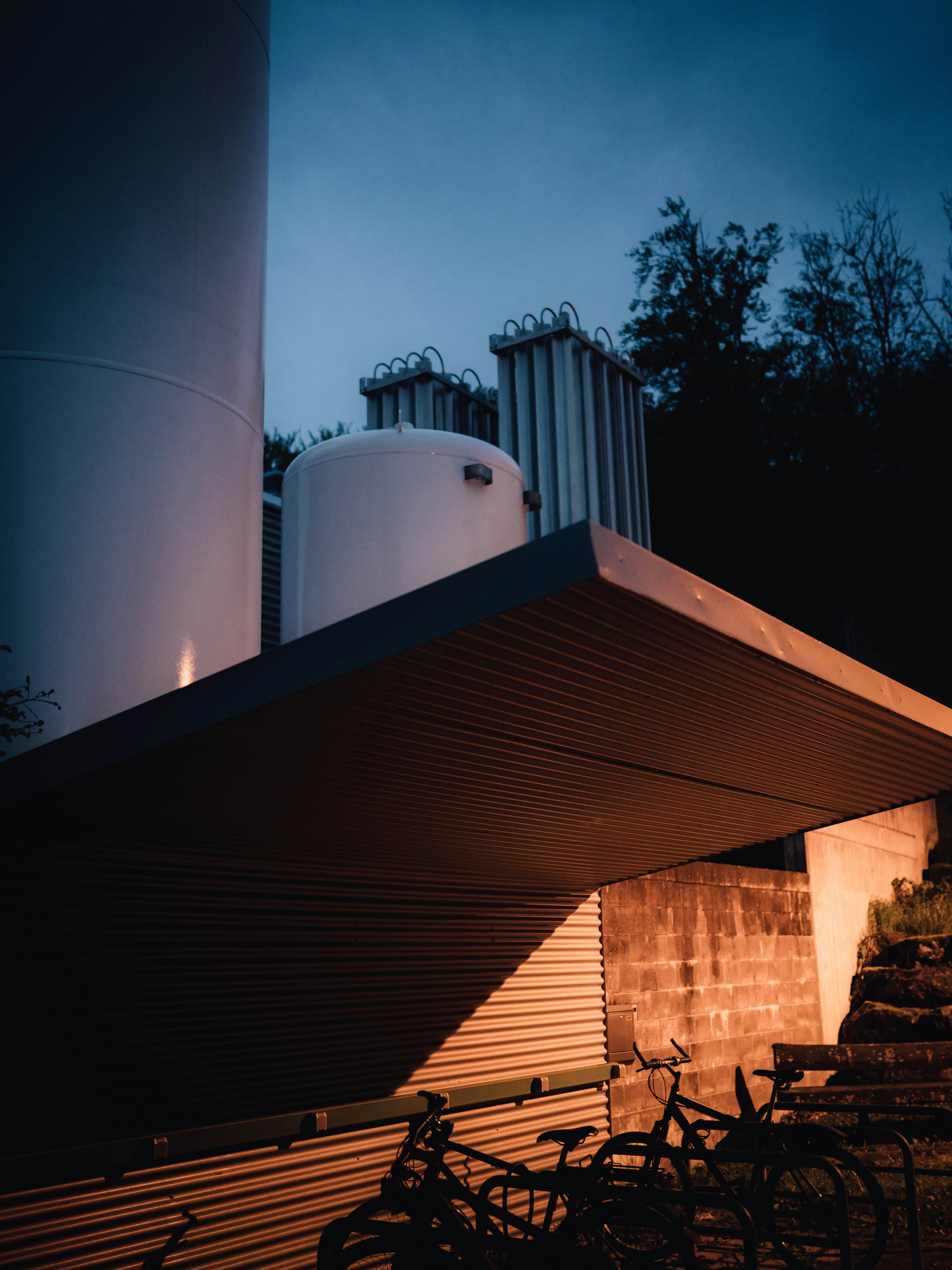 Industrial Quiet: Evening Shadows on a Modern Roofscape