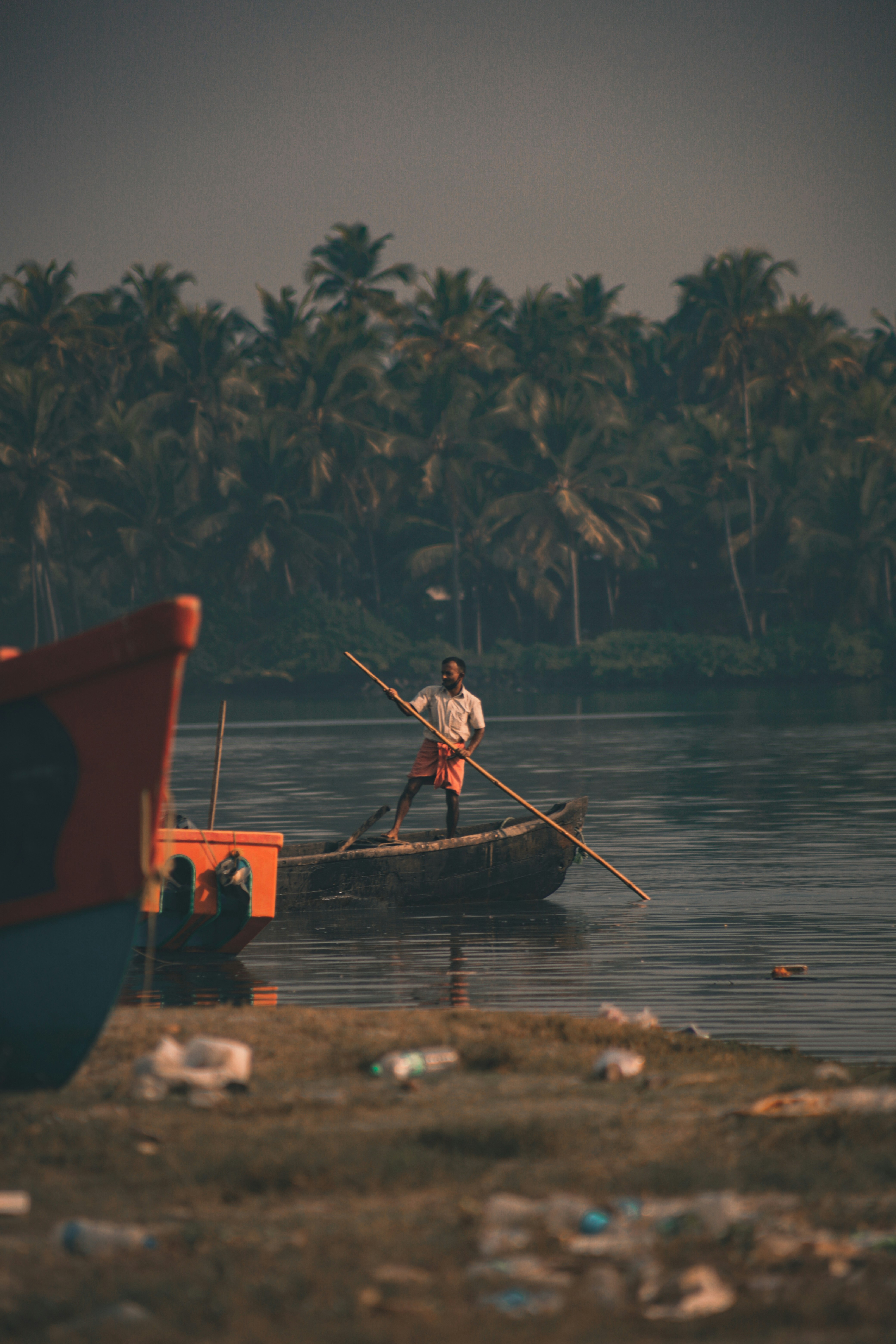 Pole and Palm: A Solitary Boatman on a Misty River