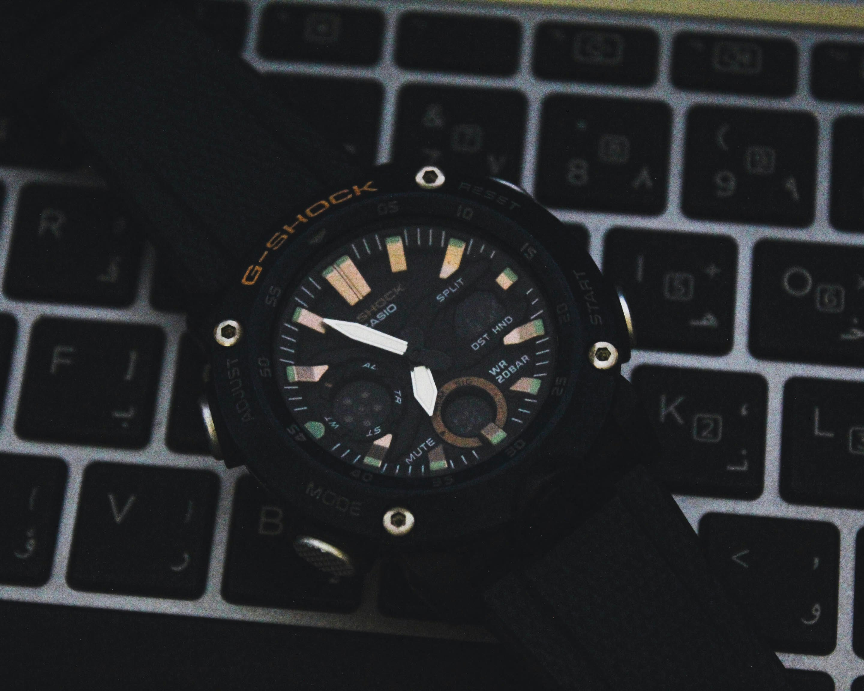 black and silver round analog watch
