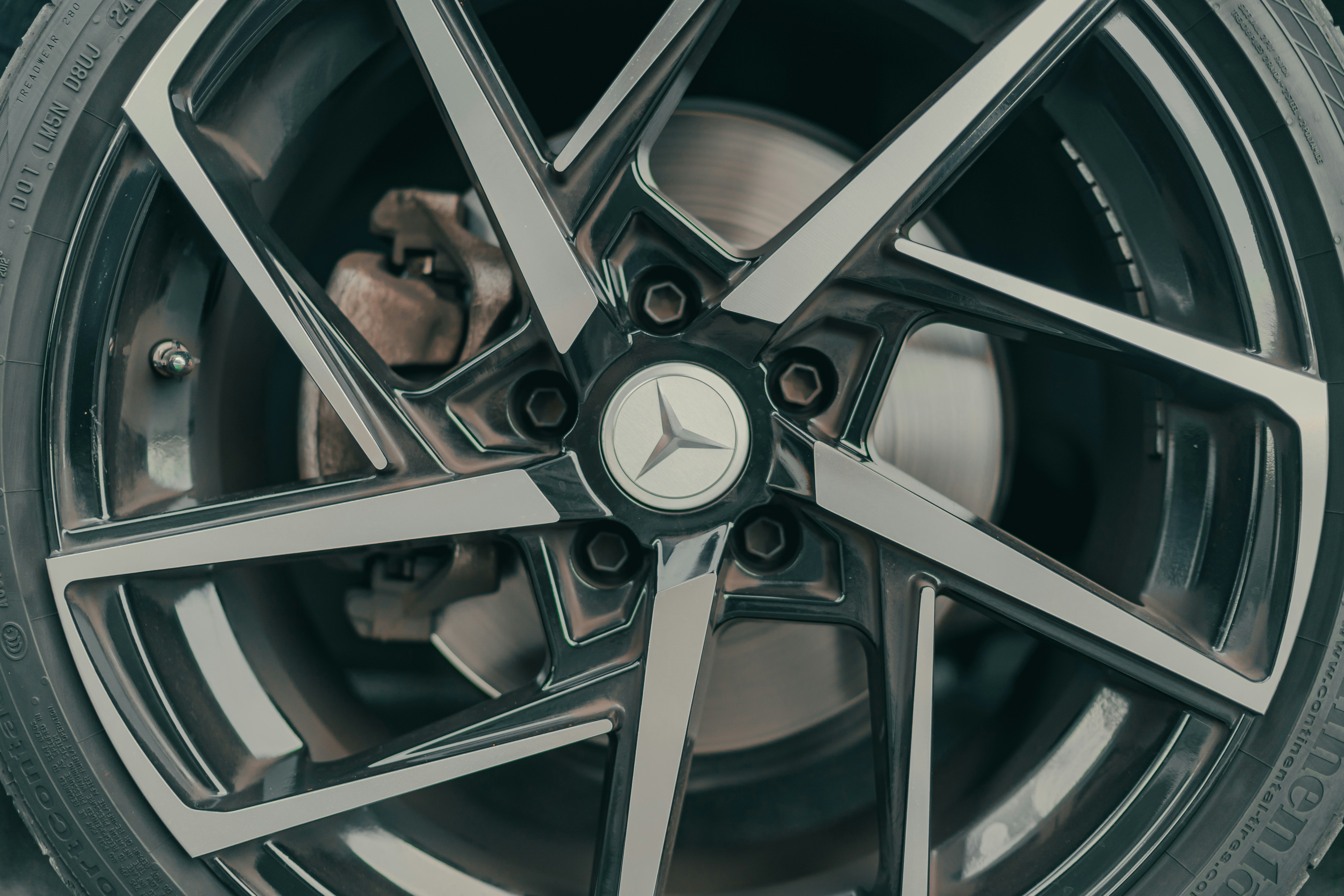 Chromed Convergence: A Macro Portrait of a Mercedes Wheel