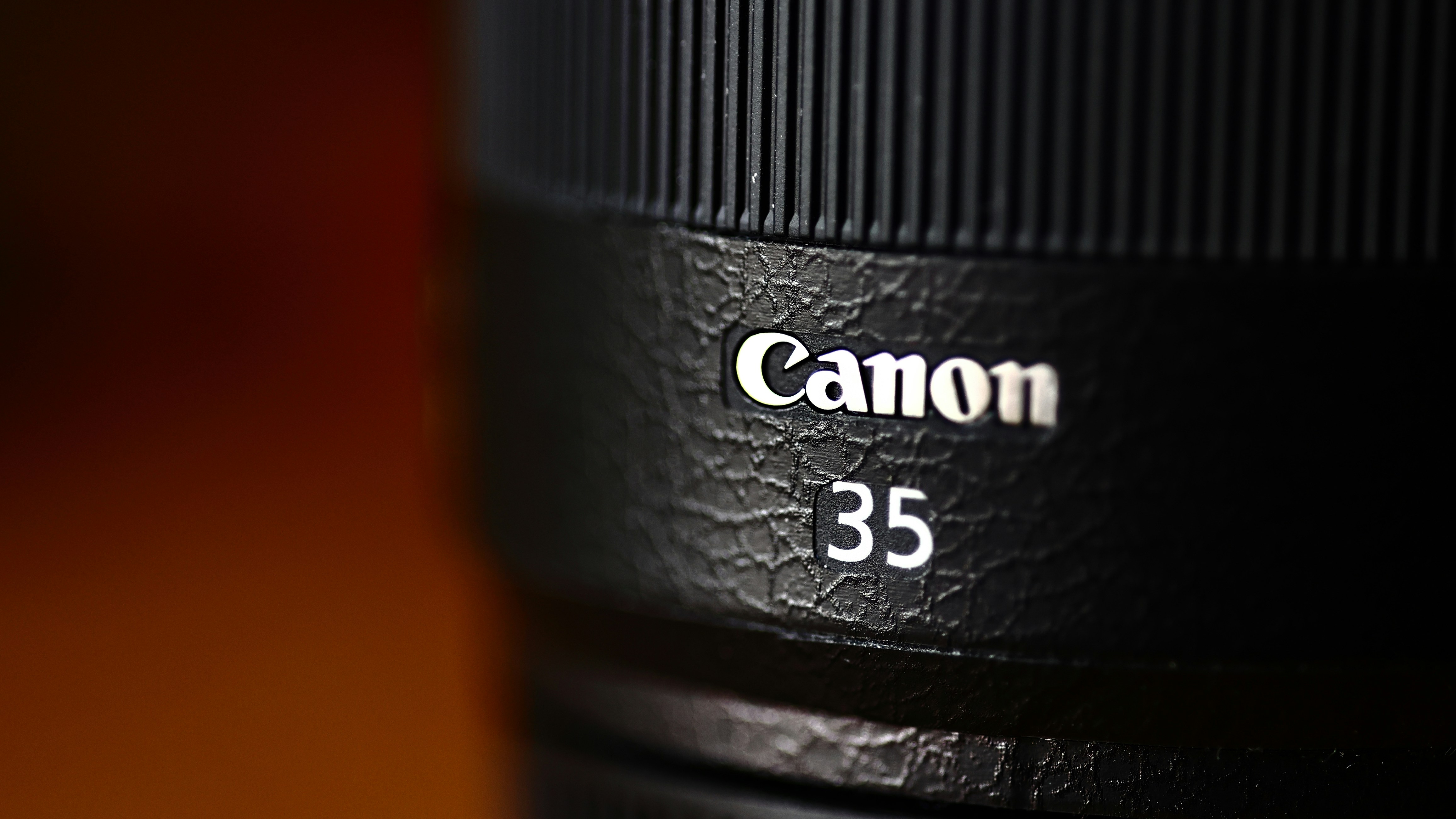 Black camera lens on orange surface photo – Free Paper Image on Unsplash